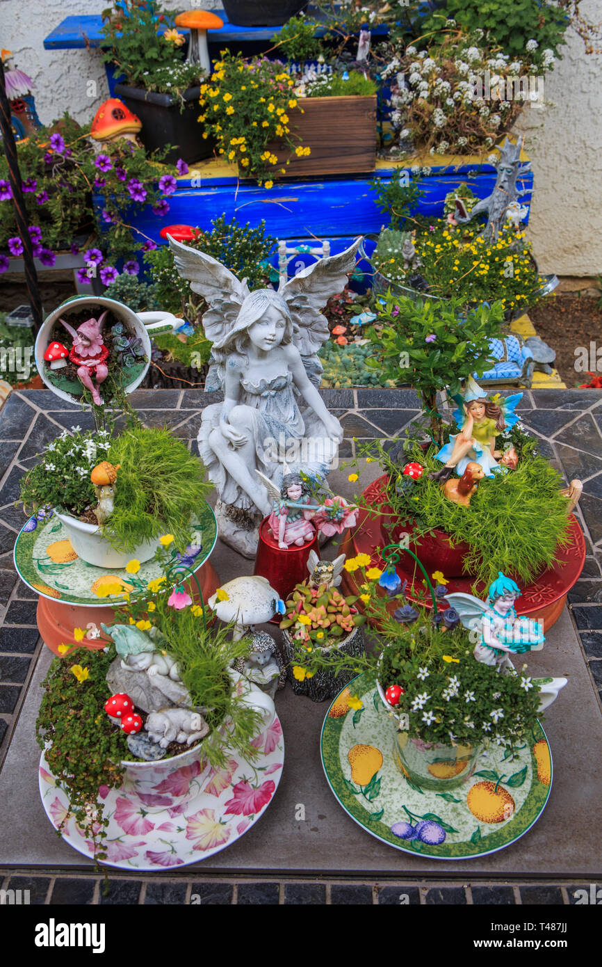 Miniature table top fairy garden with teapots and teacups used as ...