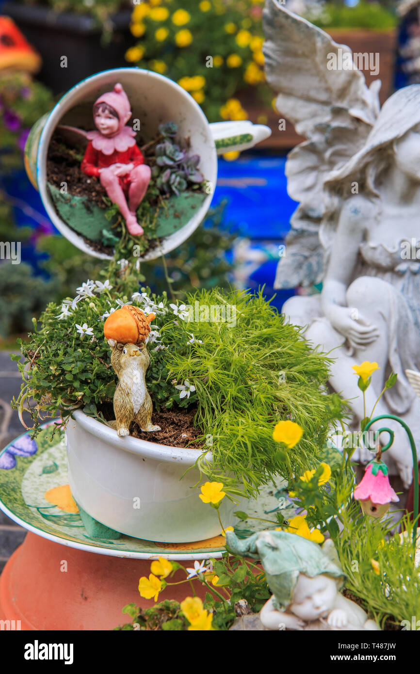 Miniature table top fairy garden with teapots and teacups used as ...