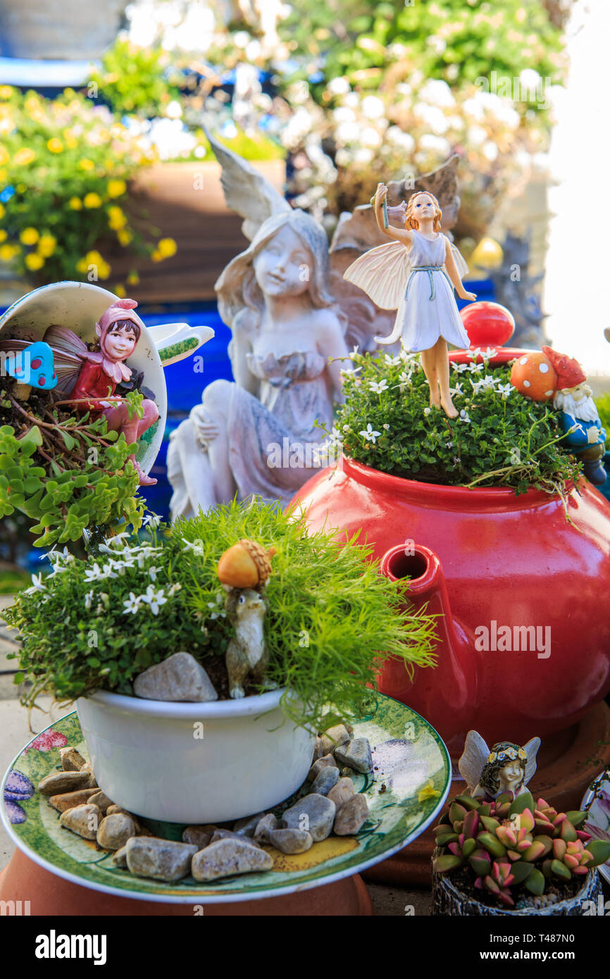Miniature table top fairy garden with teapots and teacups used as ...