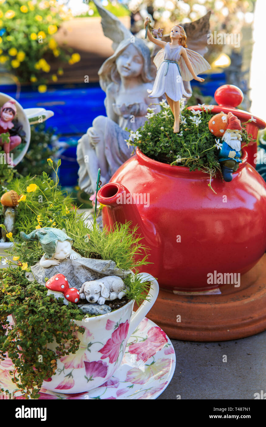 Miniature table top fairy garden with teapots and teacups used as ...