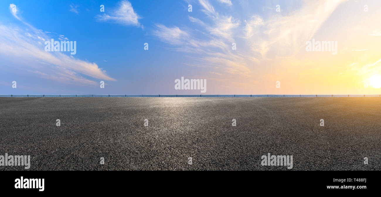 Empty asphalt road and beautiful sky clouds at sunset Stock Photo - Alamy
