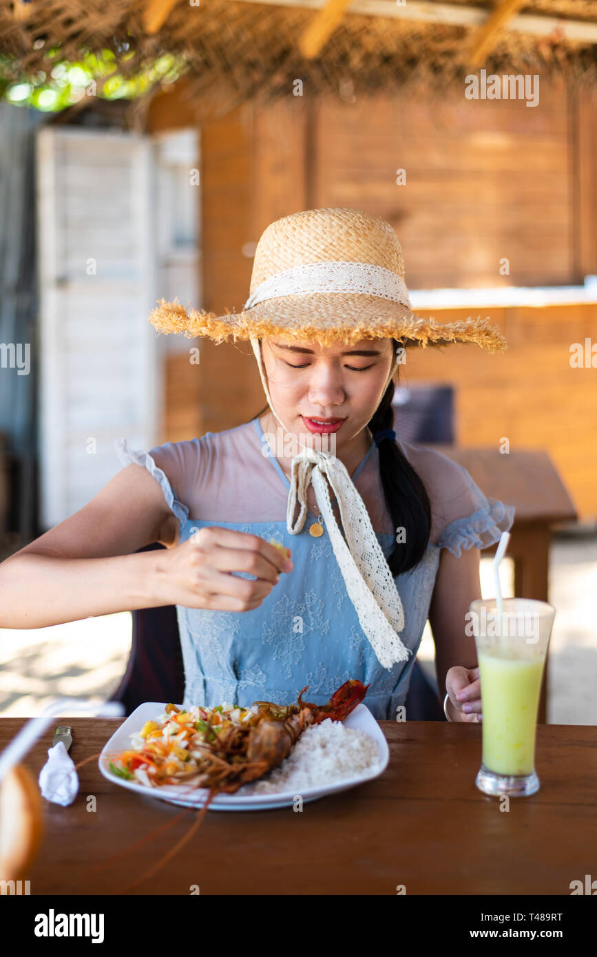 Woman holding seafood plate hi-res stock photography and images - Alamy