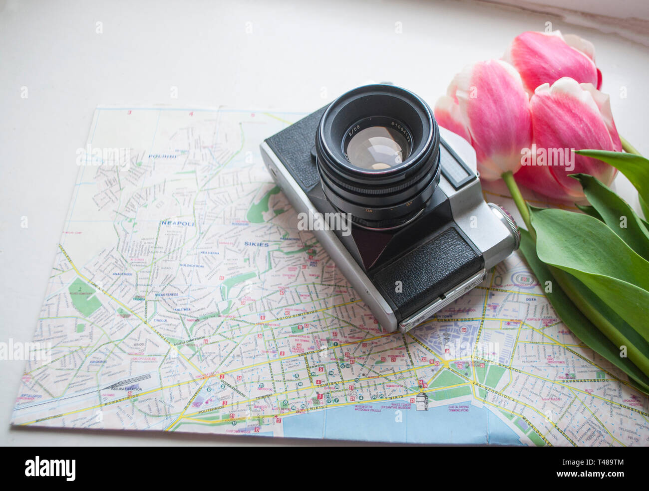Flat lay of map, camera and tulips boquet. Travel concept Stock Photo ...