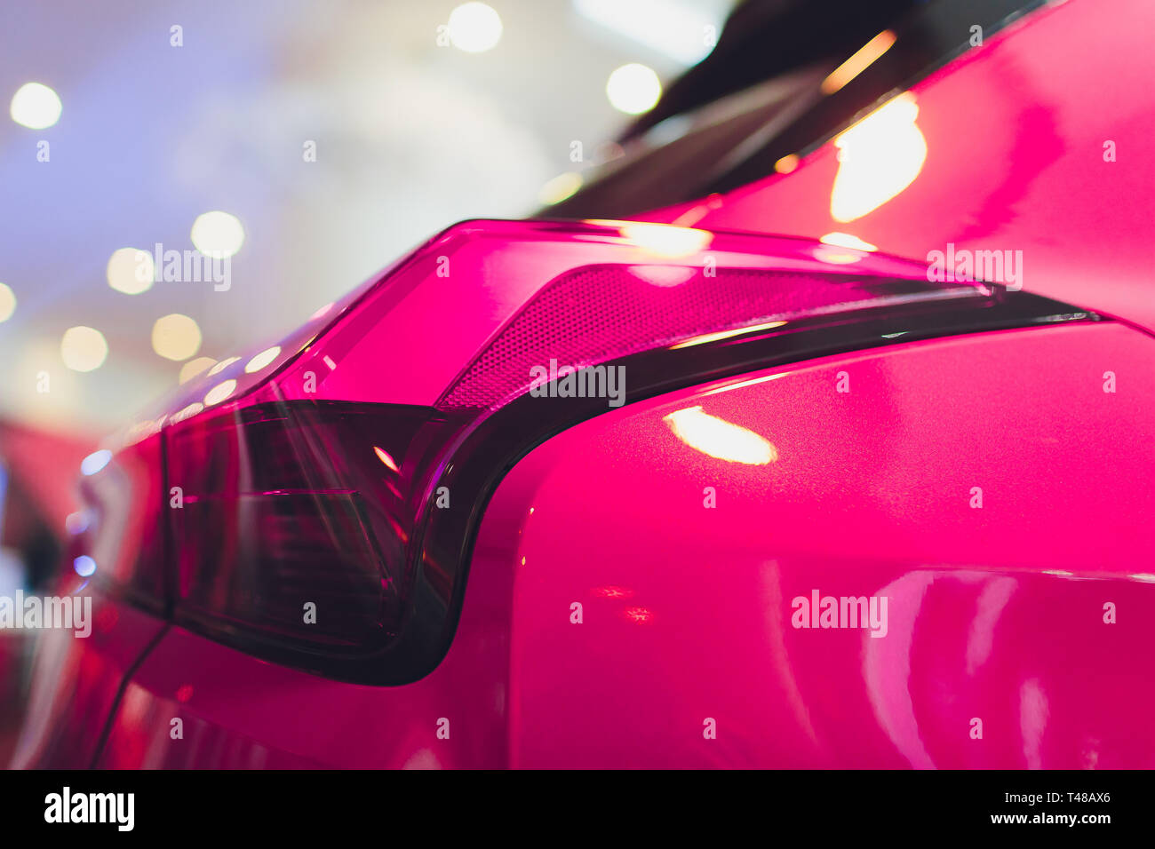Detail on the rear light of a pink car Stock Photo - Alamy