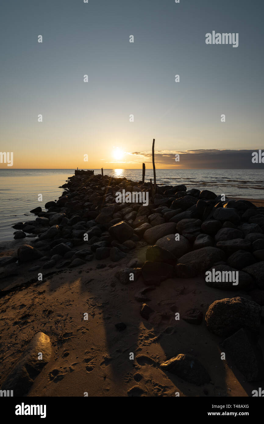 Boulder beach pier sunset with vivid red and orange colors on the ...