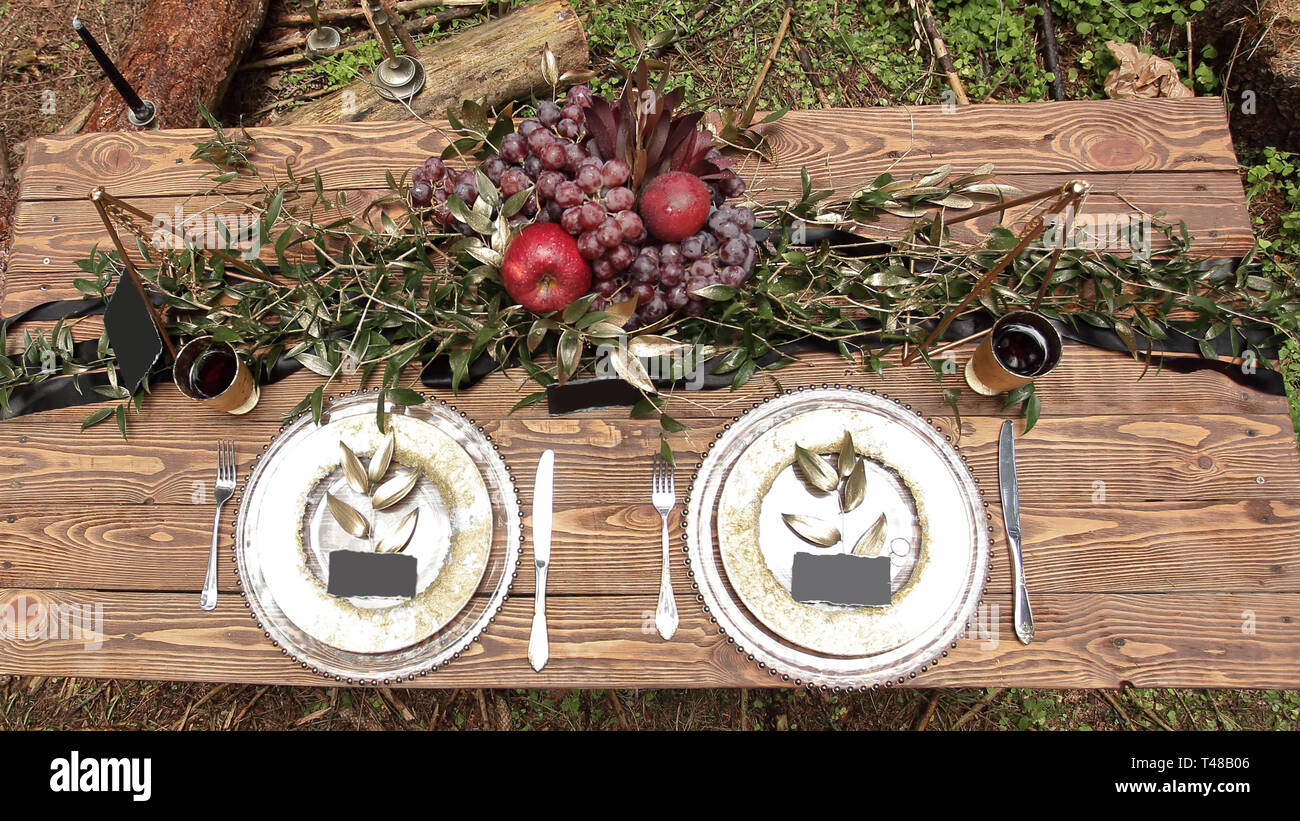 Dining table set for wedding ceremony in forest style Stock Photo - Alamy