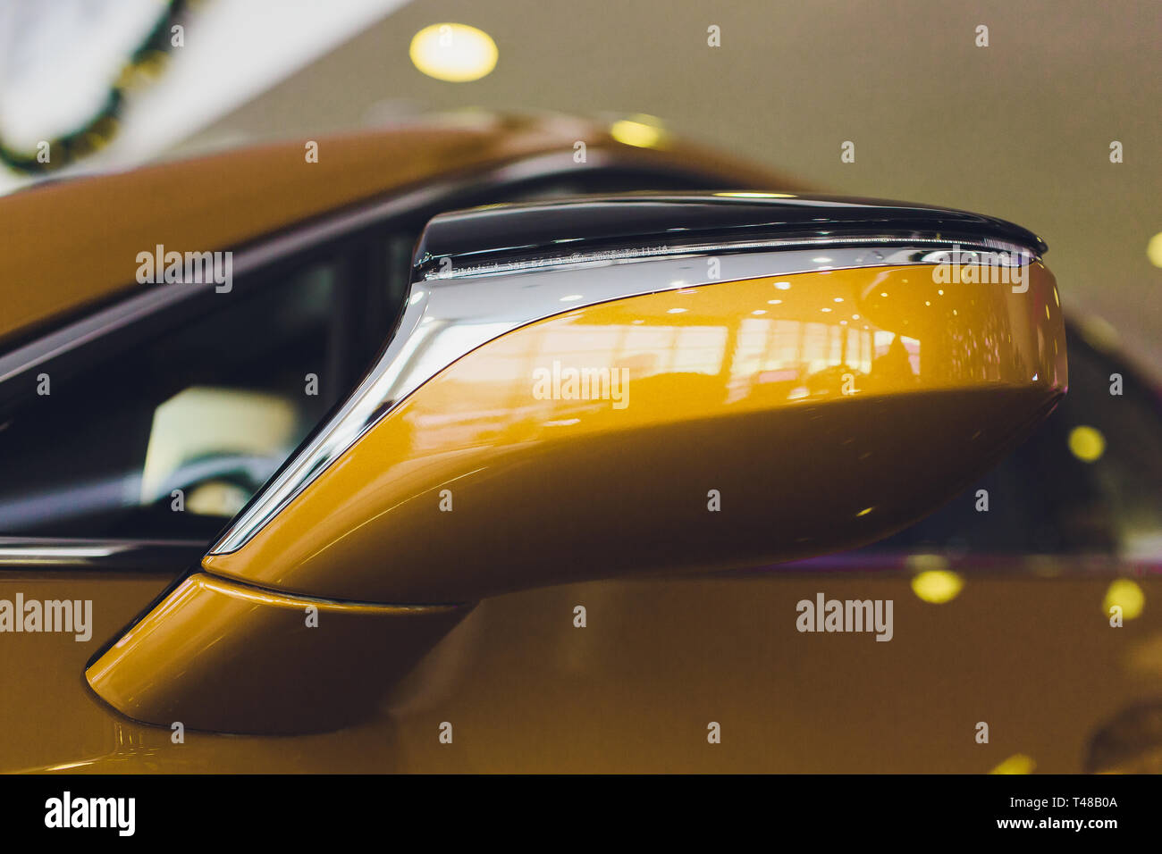 car exhibition new car rear view mirror gold Stock Photo - Alamy