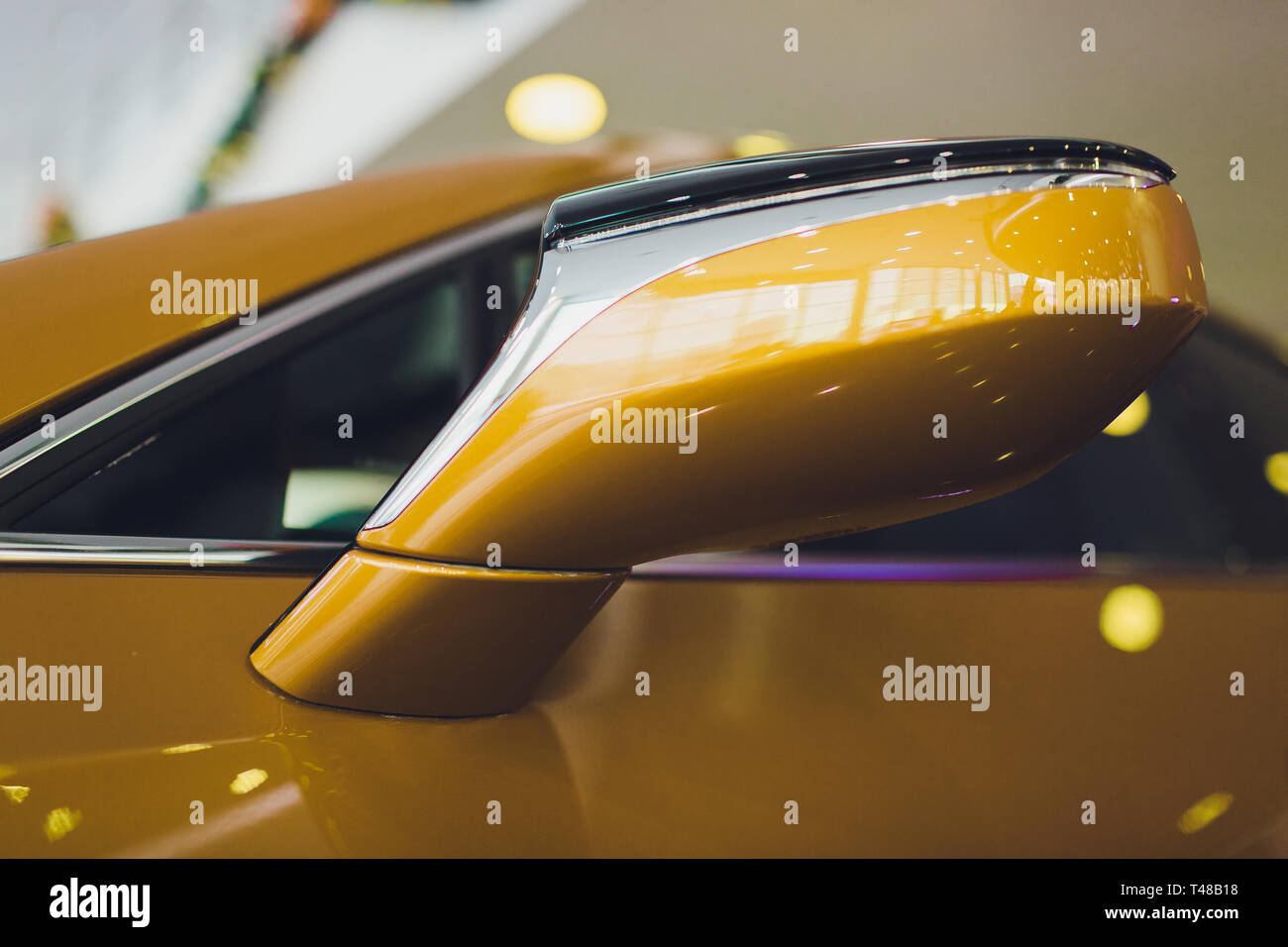 car exhibition new car rear view mirror gold Stock Photo - Alamy