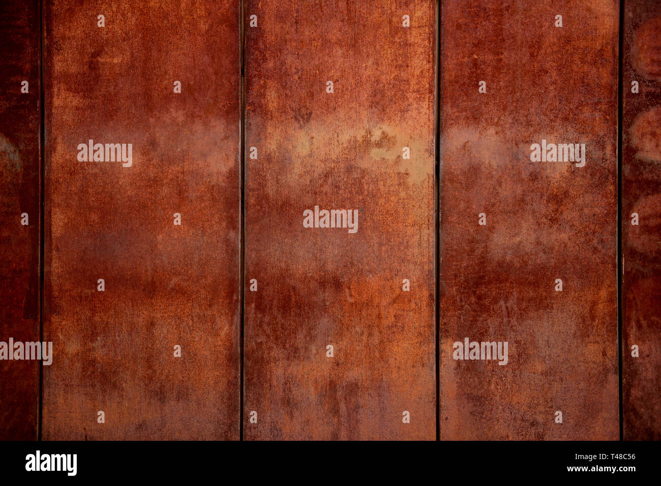 Rough textured rusty corroded weathered metal wall with vertical ...