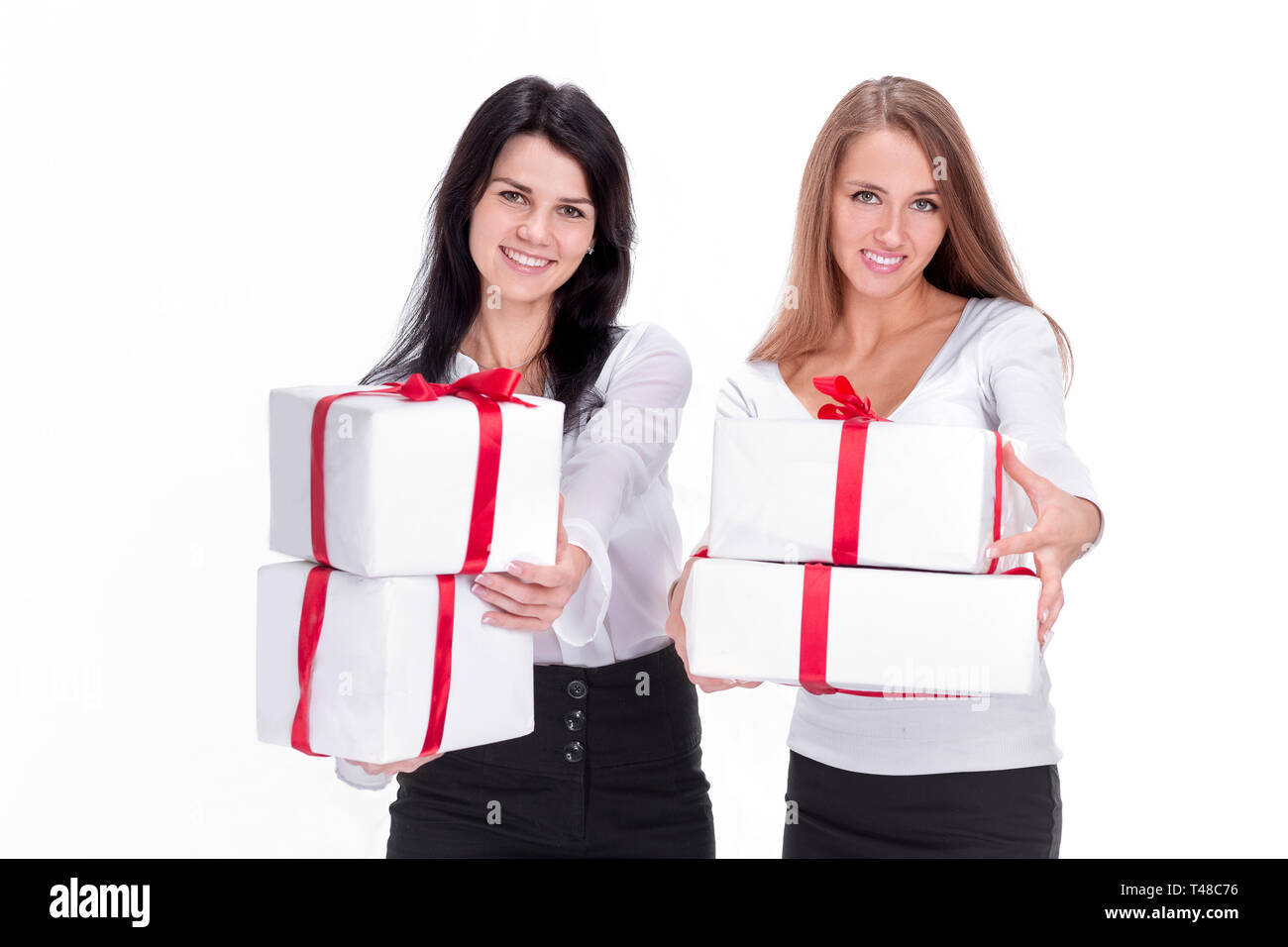 two young women with gift boxes. isolated on white background Stock ...