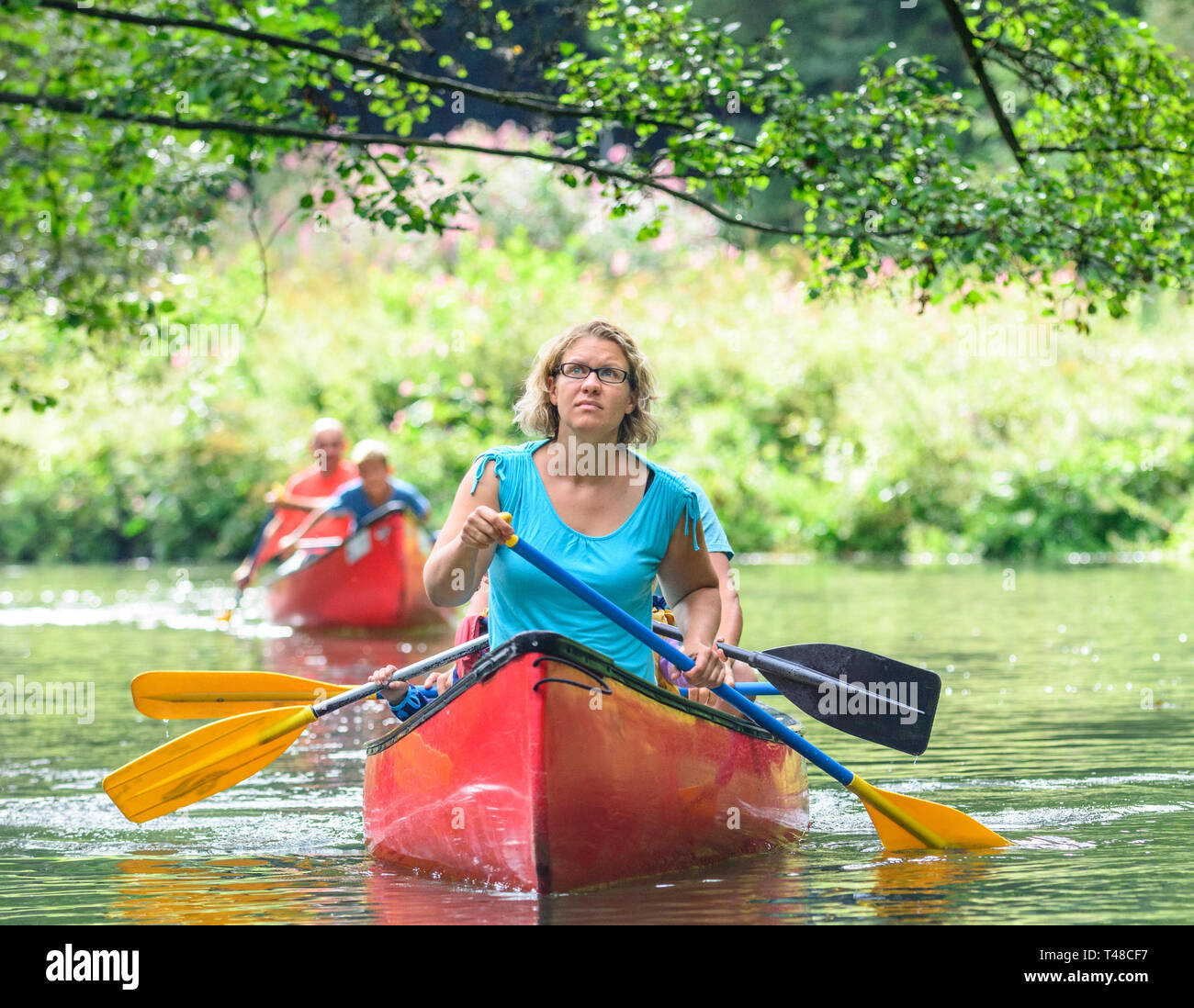 Group of people paddling on river in middle franconia Stock Photo - Alamy
