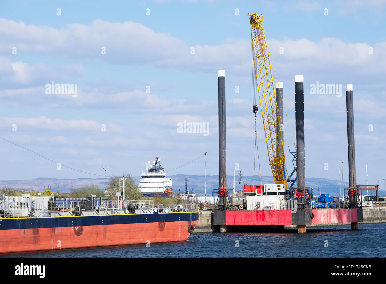 Shipbuilding crane construction large ship vessel at dock port Stock ...