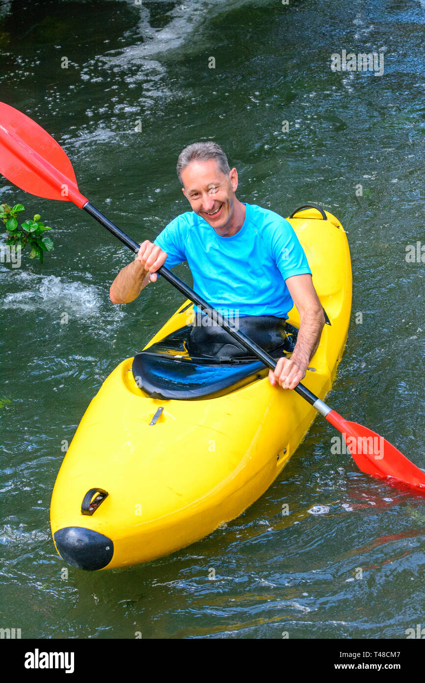 Man sitting in kayak in hi-res stock photography and images - Alamy