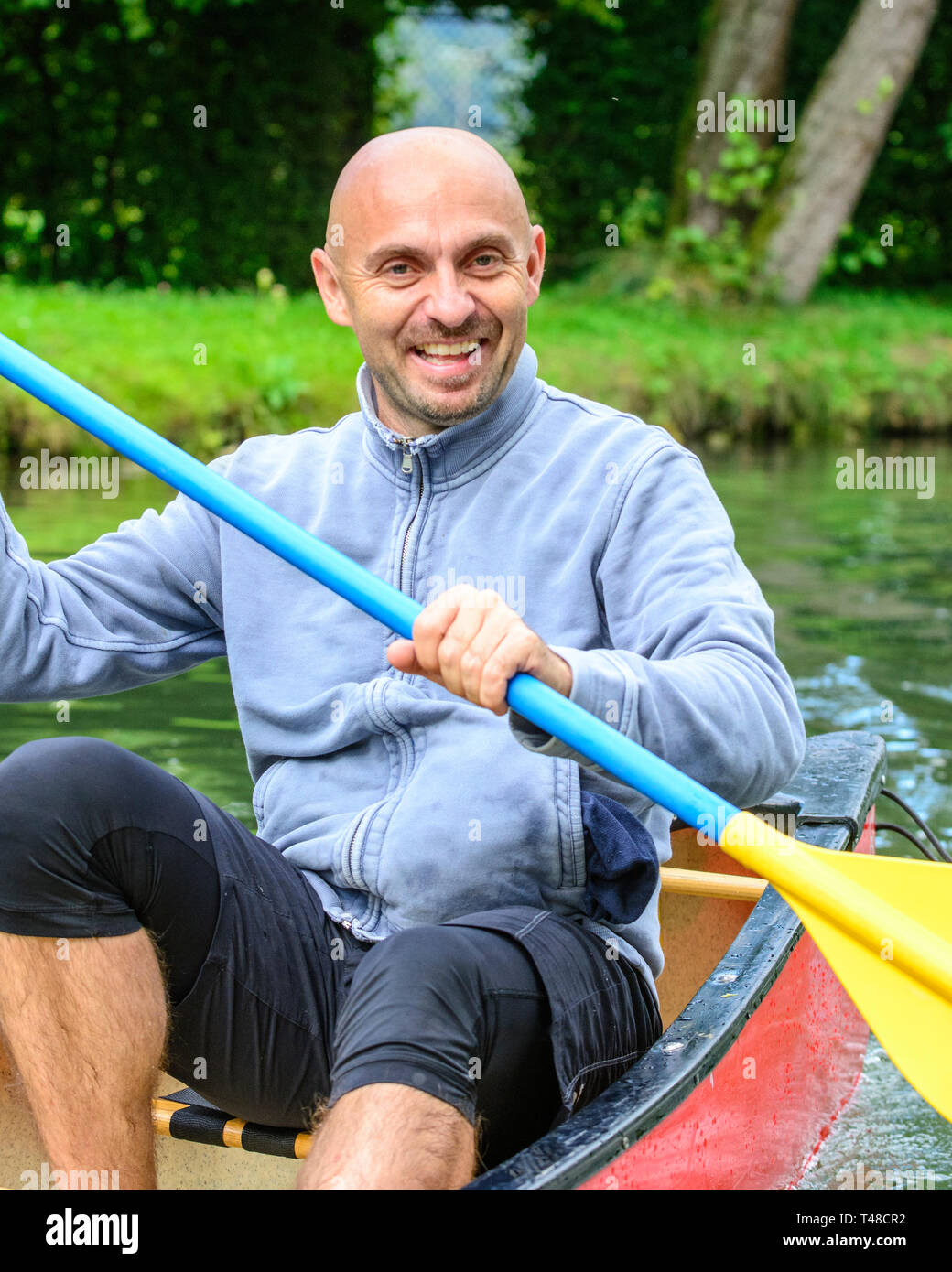 Canoeist enjoying a tour on a idyllic river Stock Photo - Alamy