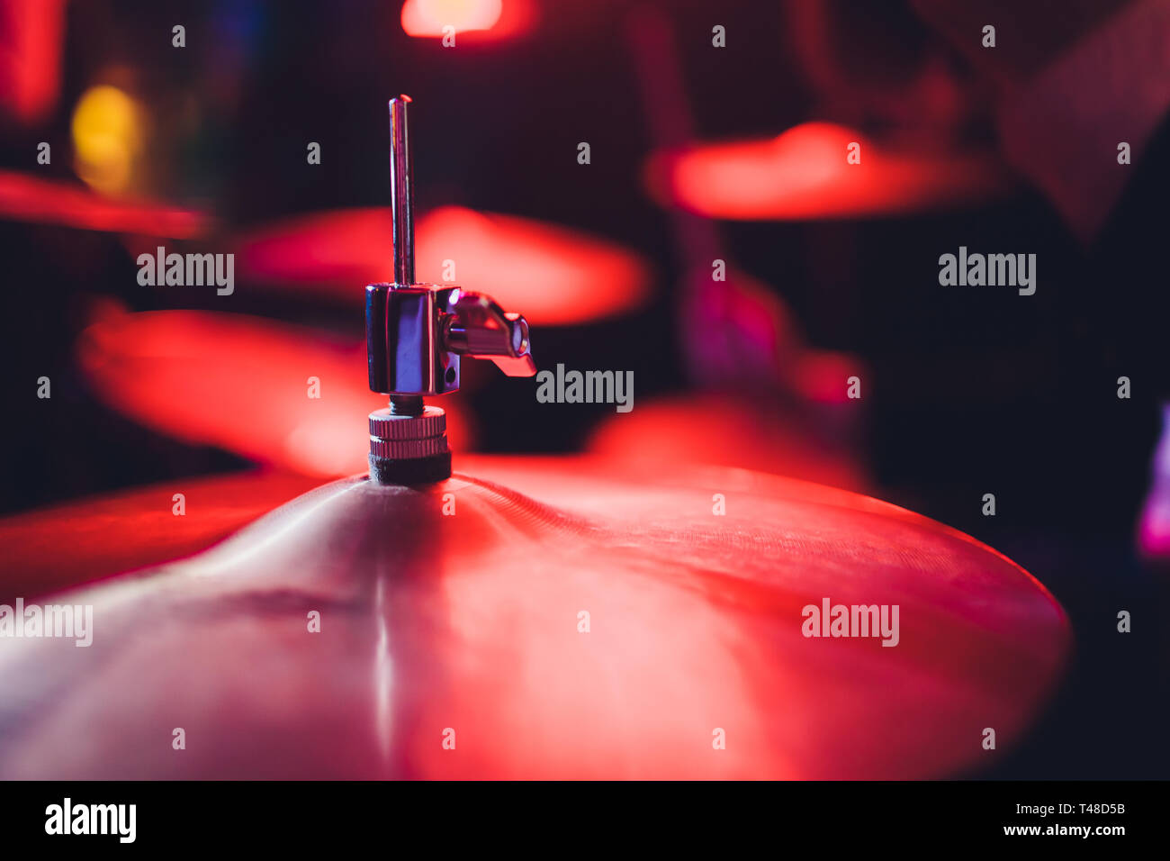 Warm toned live music photo background, drummer plays on rock drum set ...