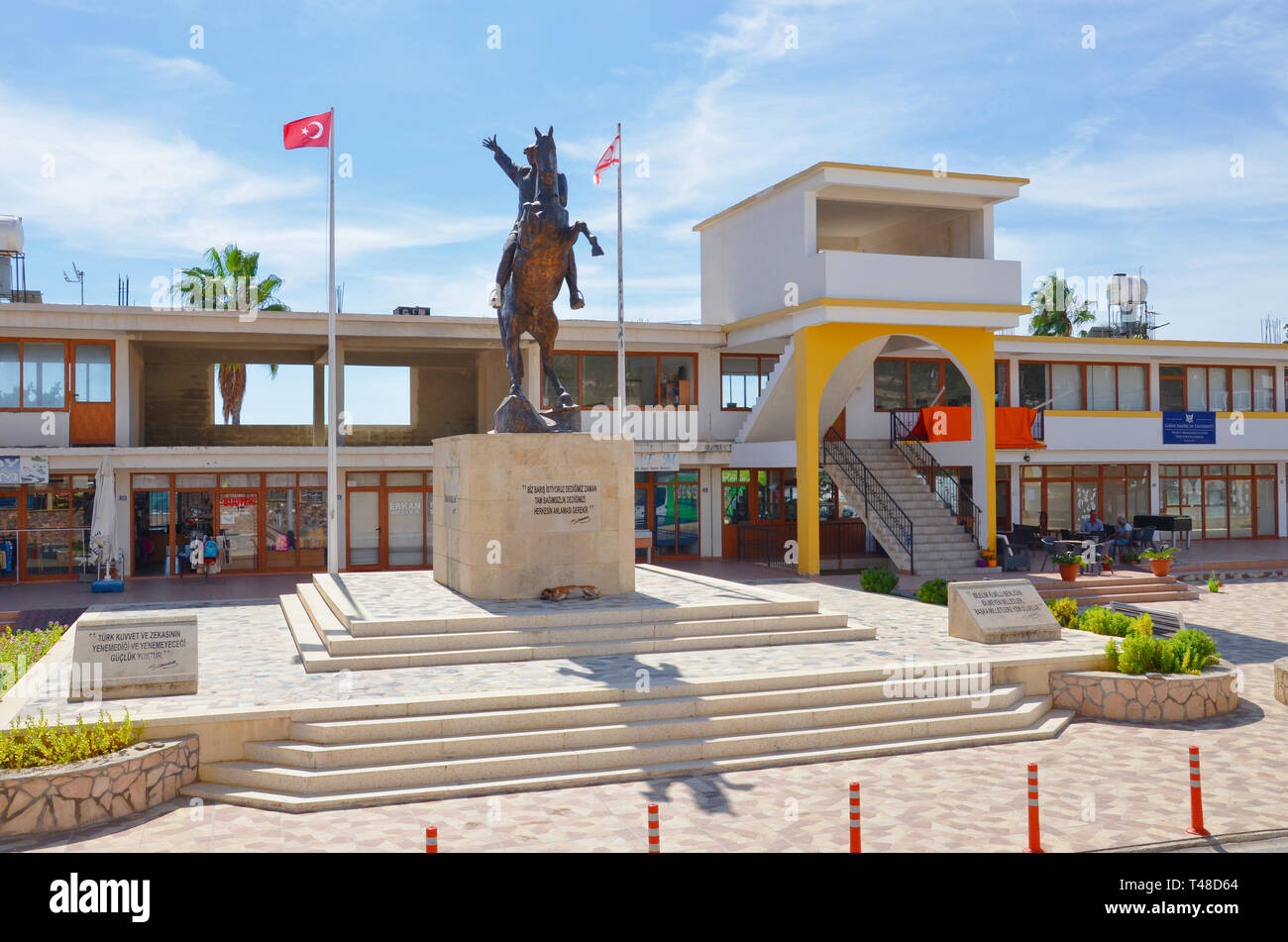 Statue of Mustafa Kemal Ataturk on a small square with shops in the ...