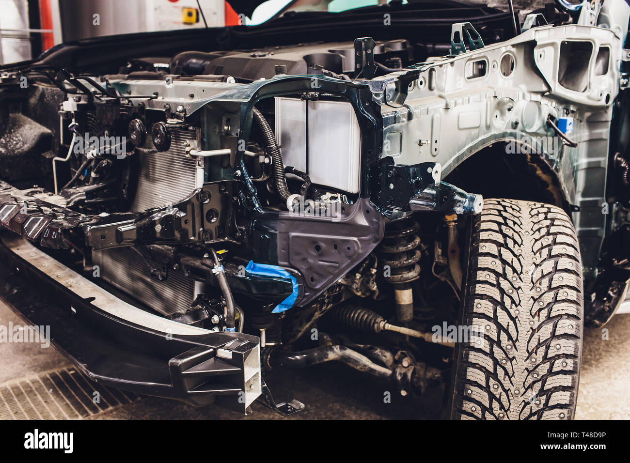 wires from the car wiring lies in the cabin of the dismantled car with ...