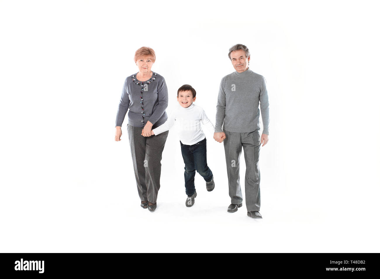 grandma and grandpa go with her grandson.isolated on white background ...