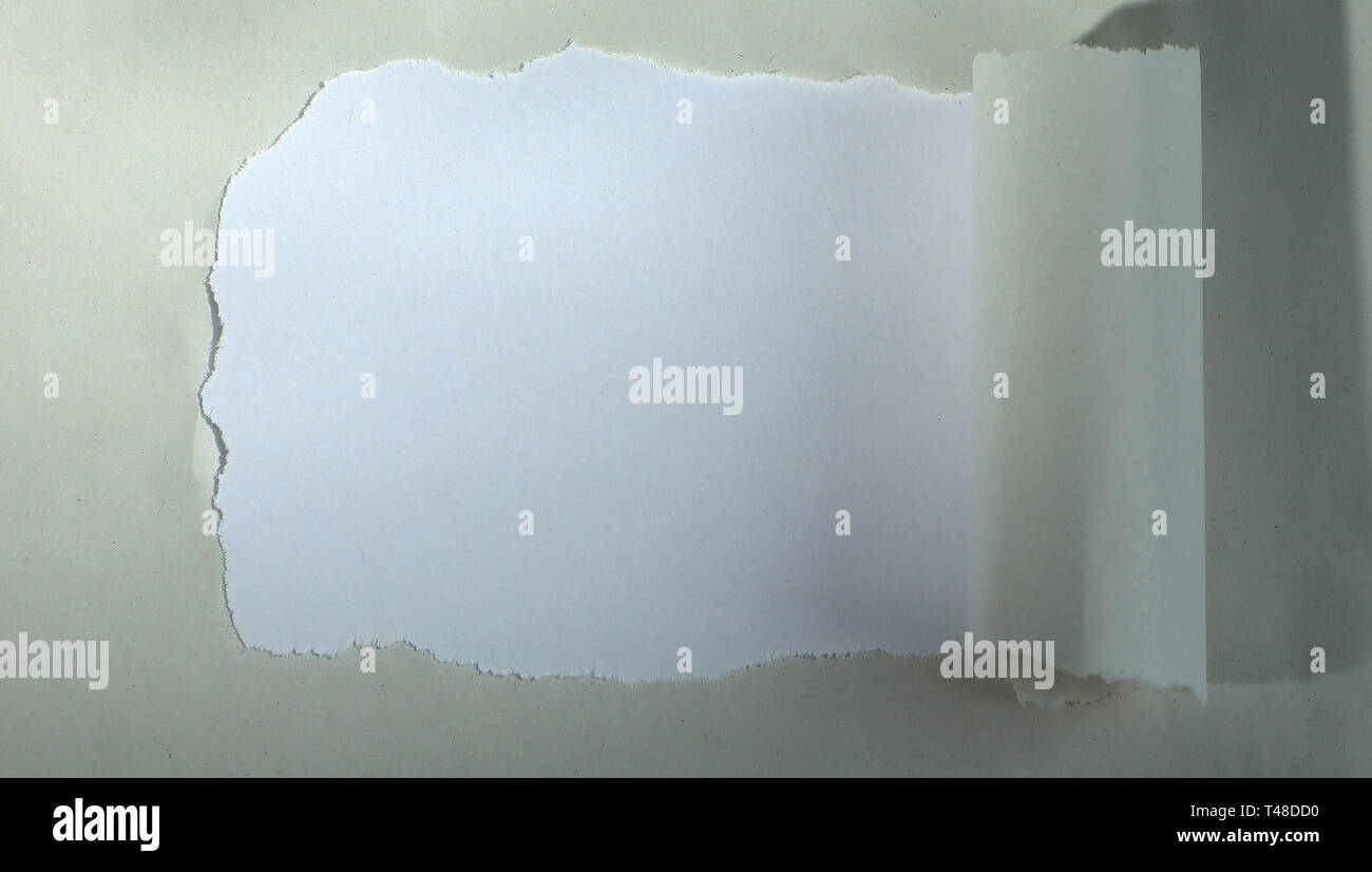 hole in the paper with torn edges.background.photo with copy space ...