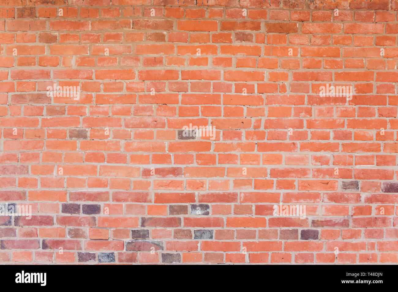 Rustic red brick wall used for house construction Stock Photo - Alamy