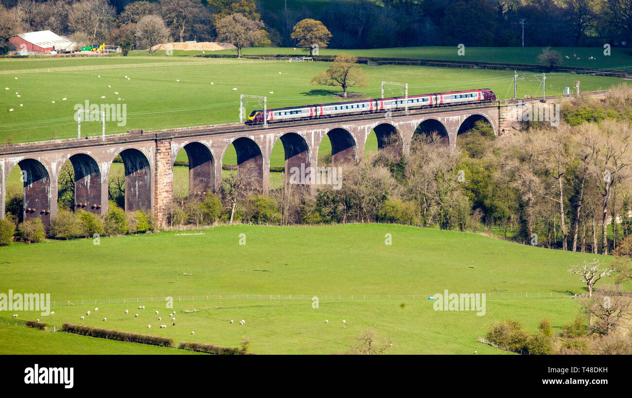 Electric train on the railway over the viaduct bridge on the Cheshire ...