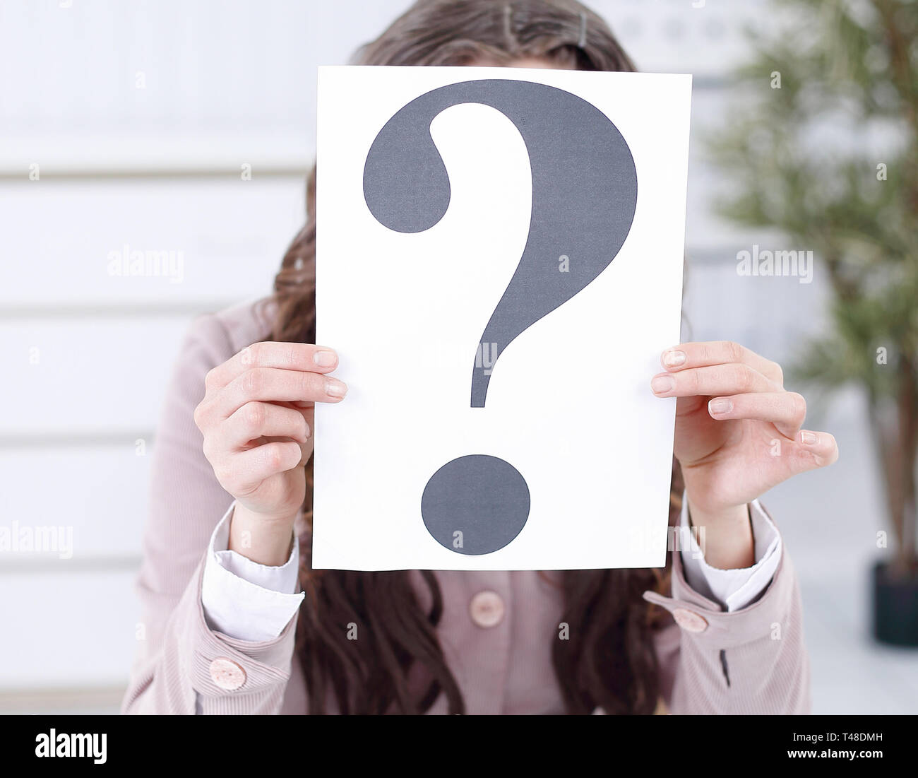 young business woman showing a question mark.business background Stock ...