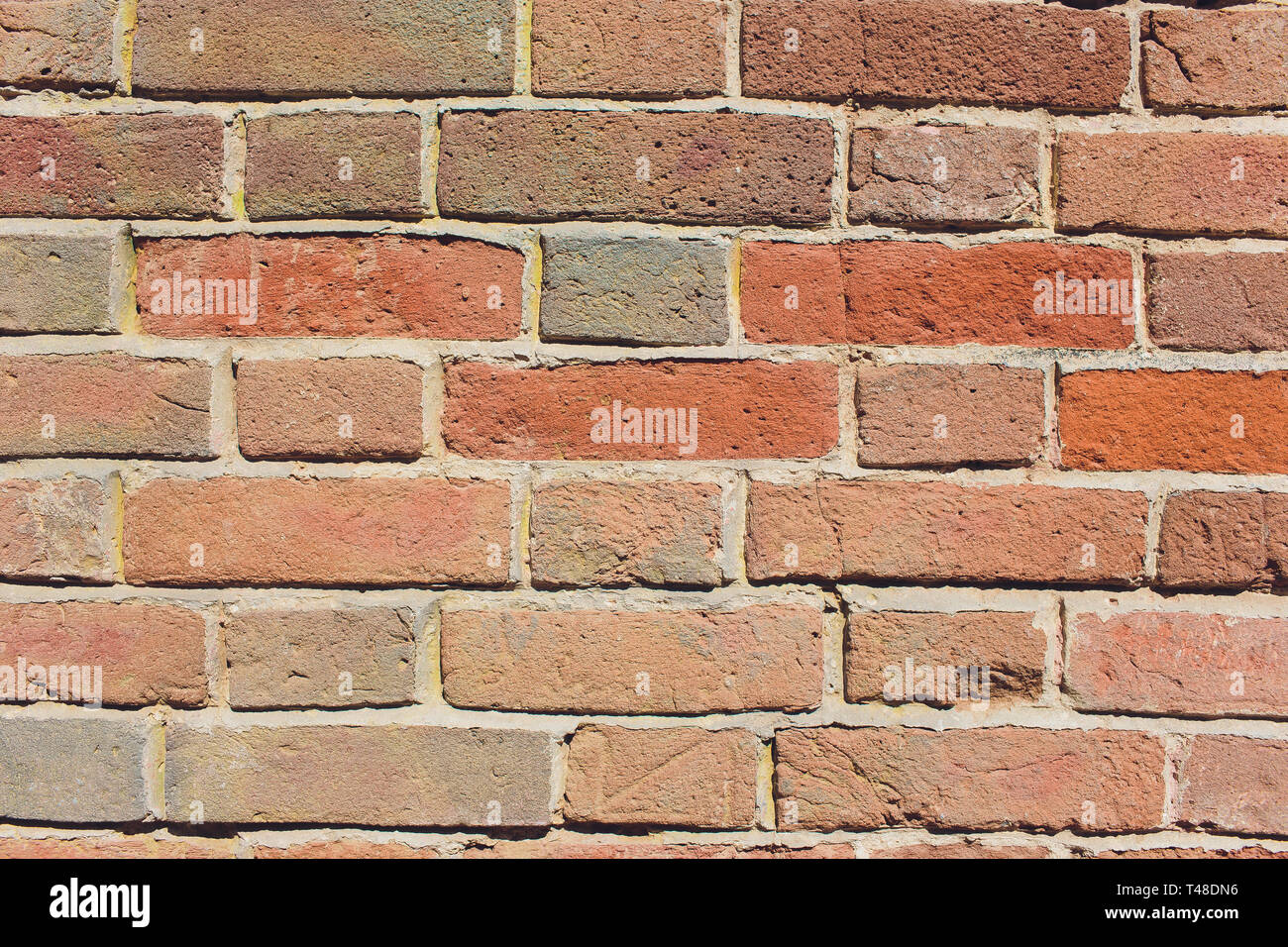 Rustic red brick wall used for house construction Stock Photo - Alamy