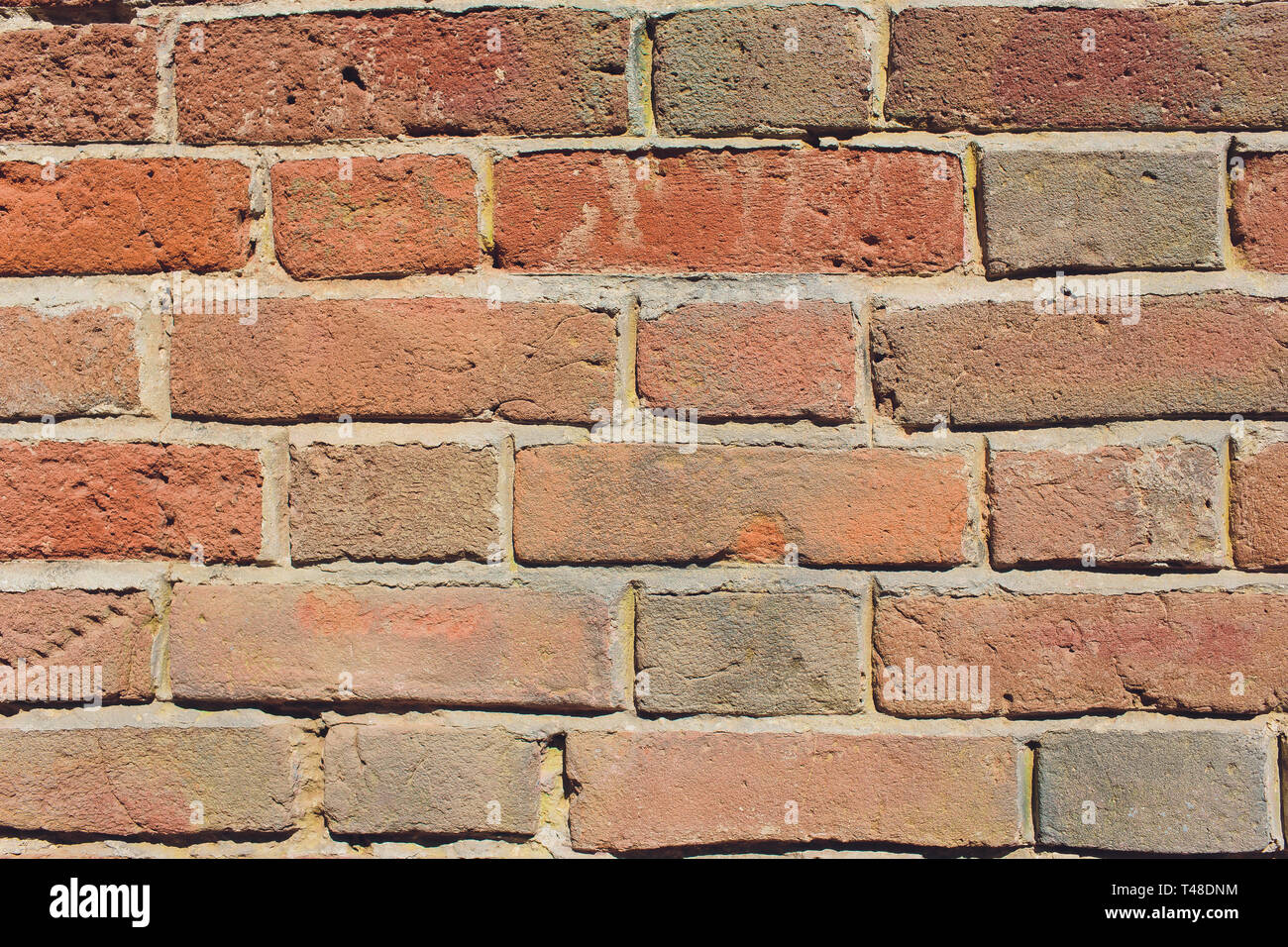 Rustic red brick wall used for house construction Stock Photo - Alamy