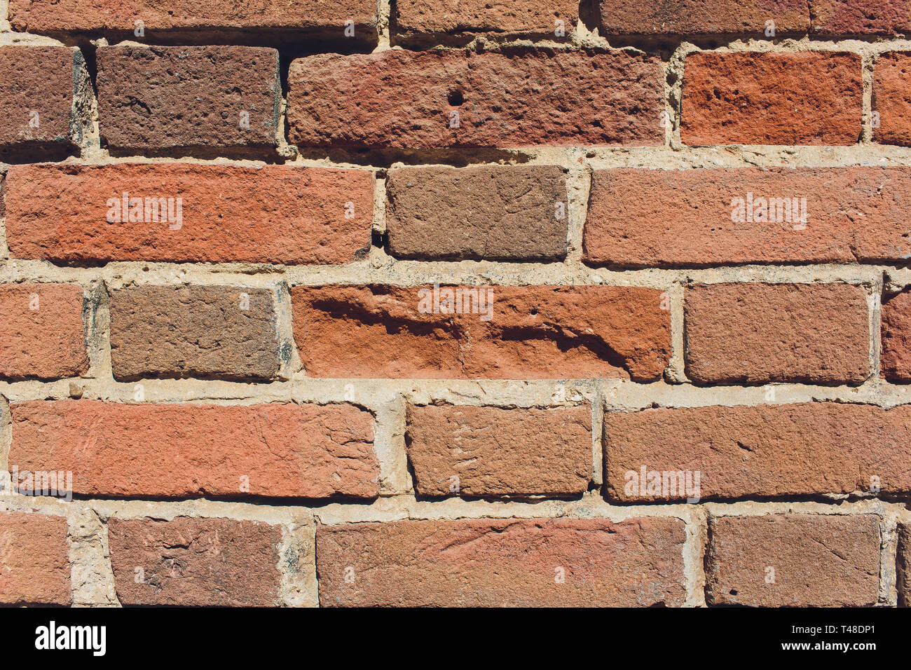 Rustic red brick wall used for house construction Stock Photo - Alamy