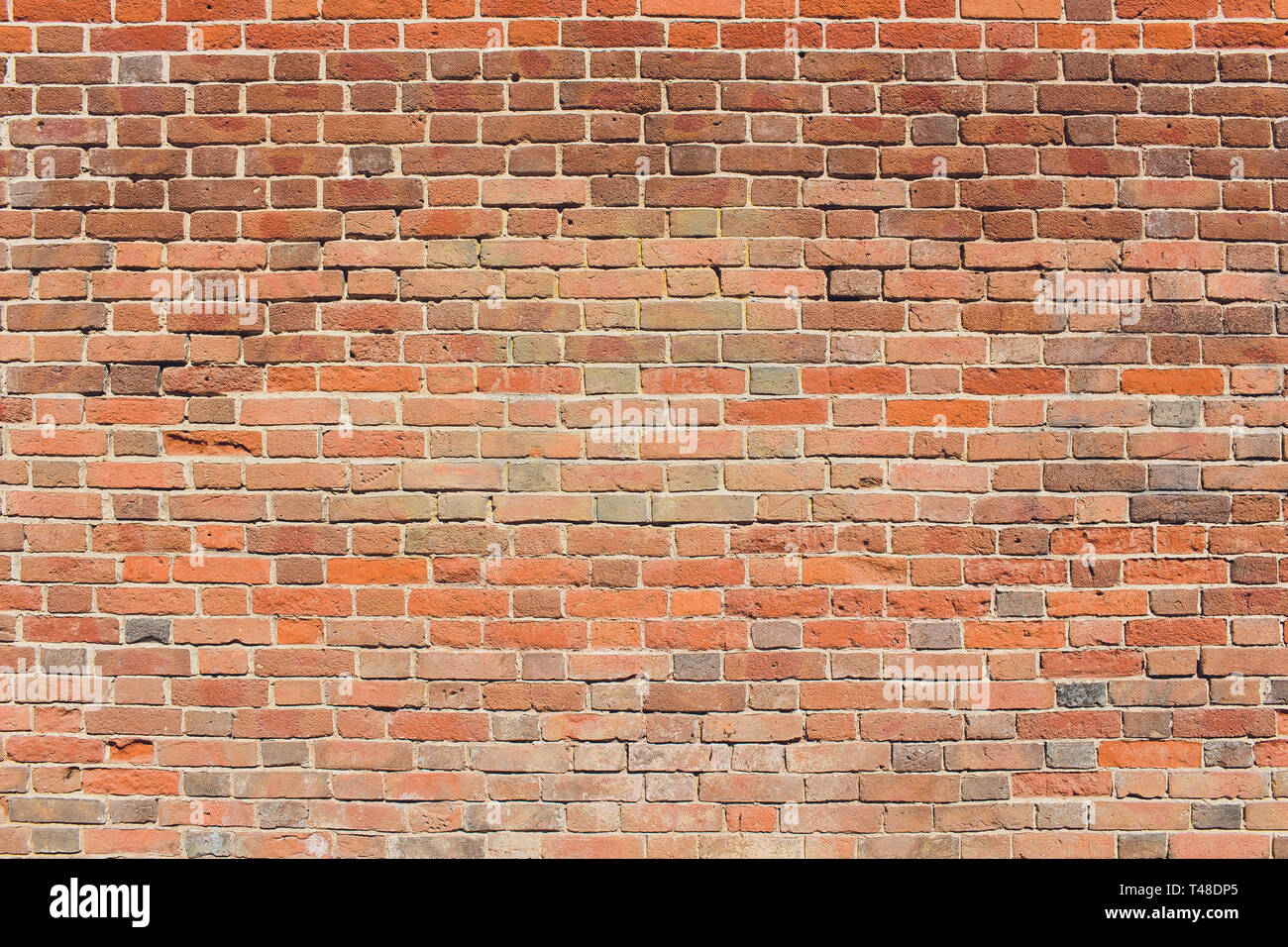 Rustic red brick wall used for house construction Stock Photo - Alamy