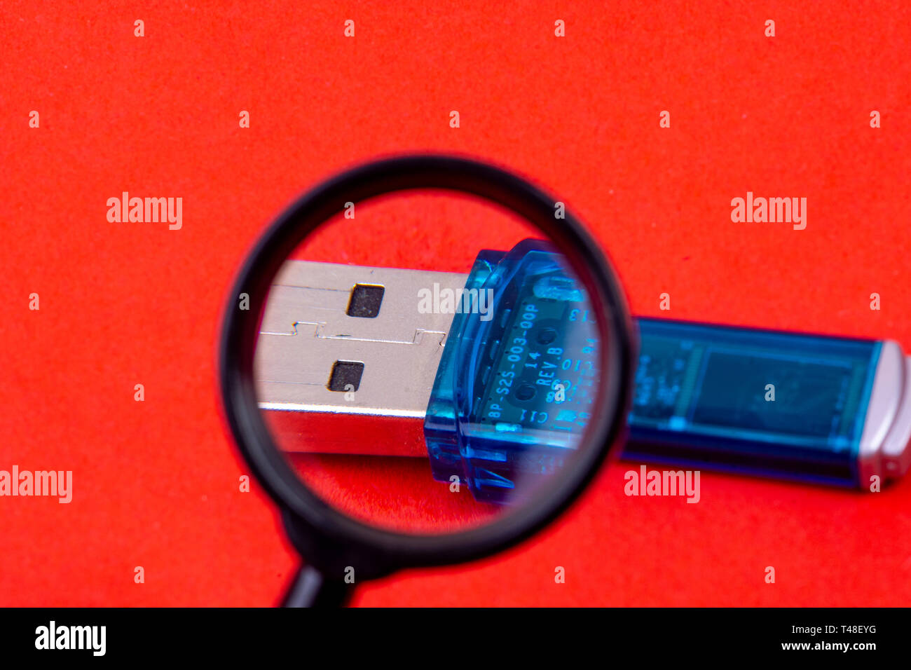 Data stick under the magnifying glass - search for clues Stock Photo ...