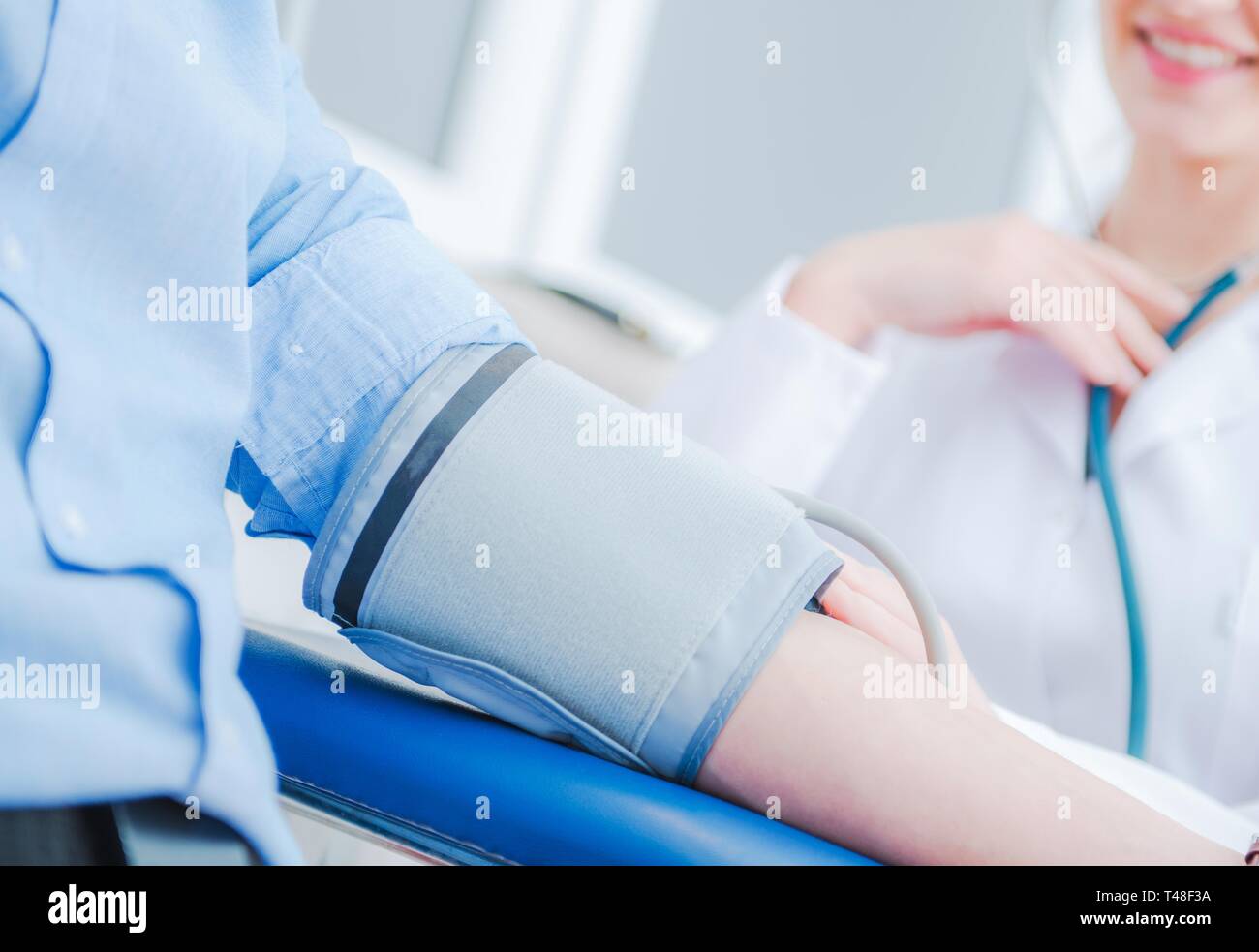 Blood Pressure Monitoring. Caucasian Patient in the Doctor Office Stock ...