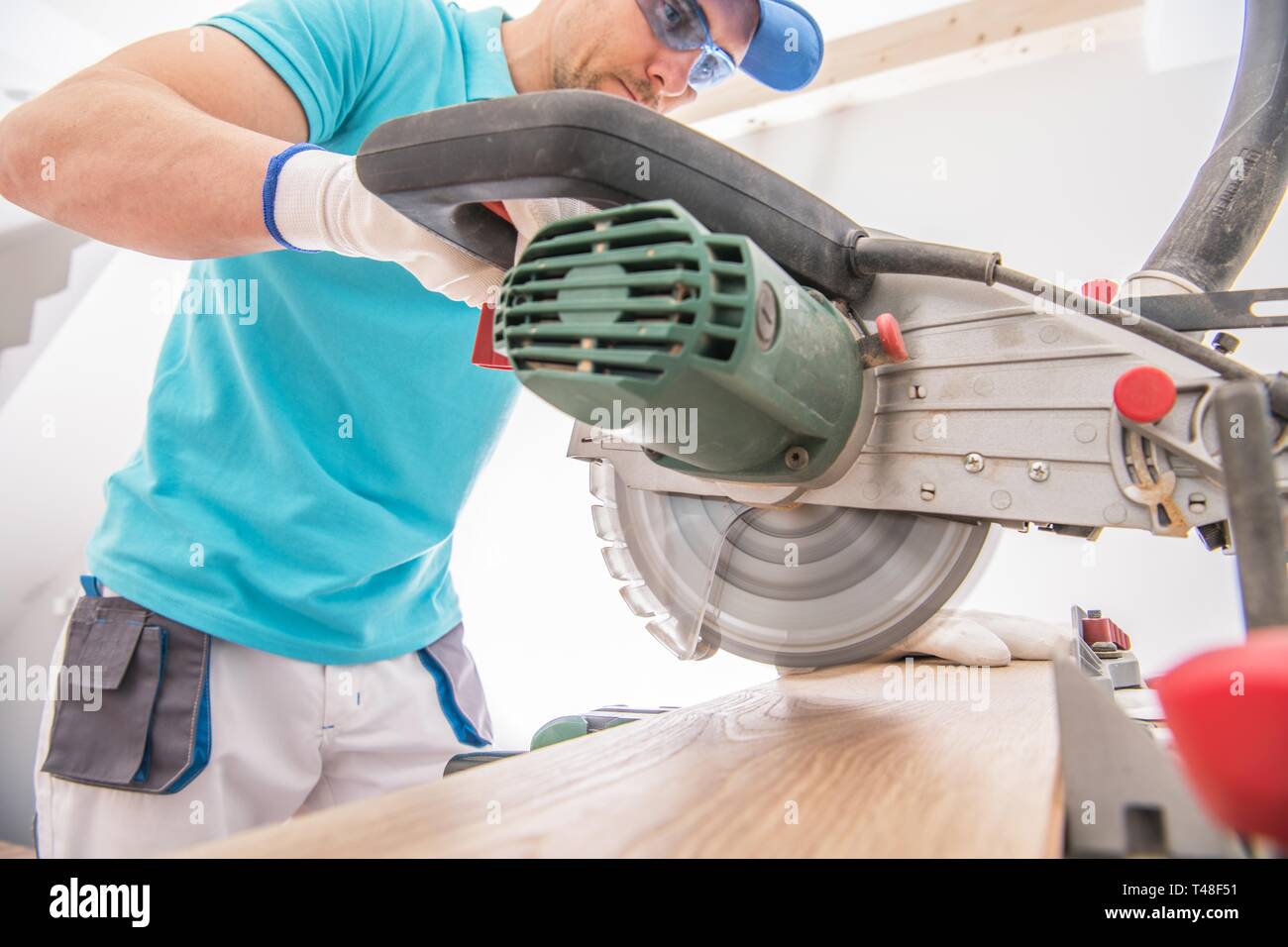 Circular Saw Cutting Job. Contractor Worker and the Power Tool ...