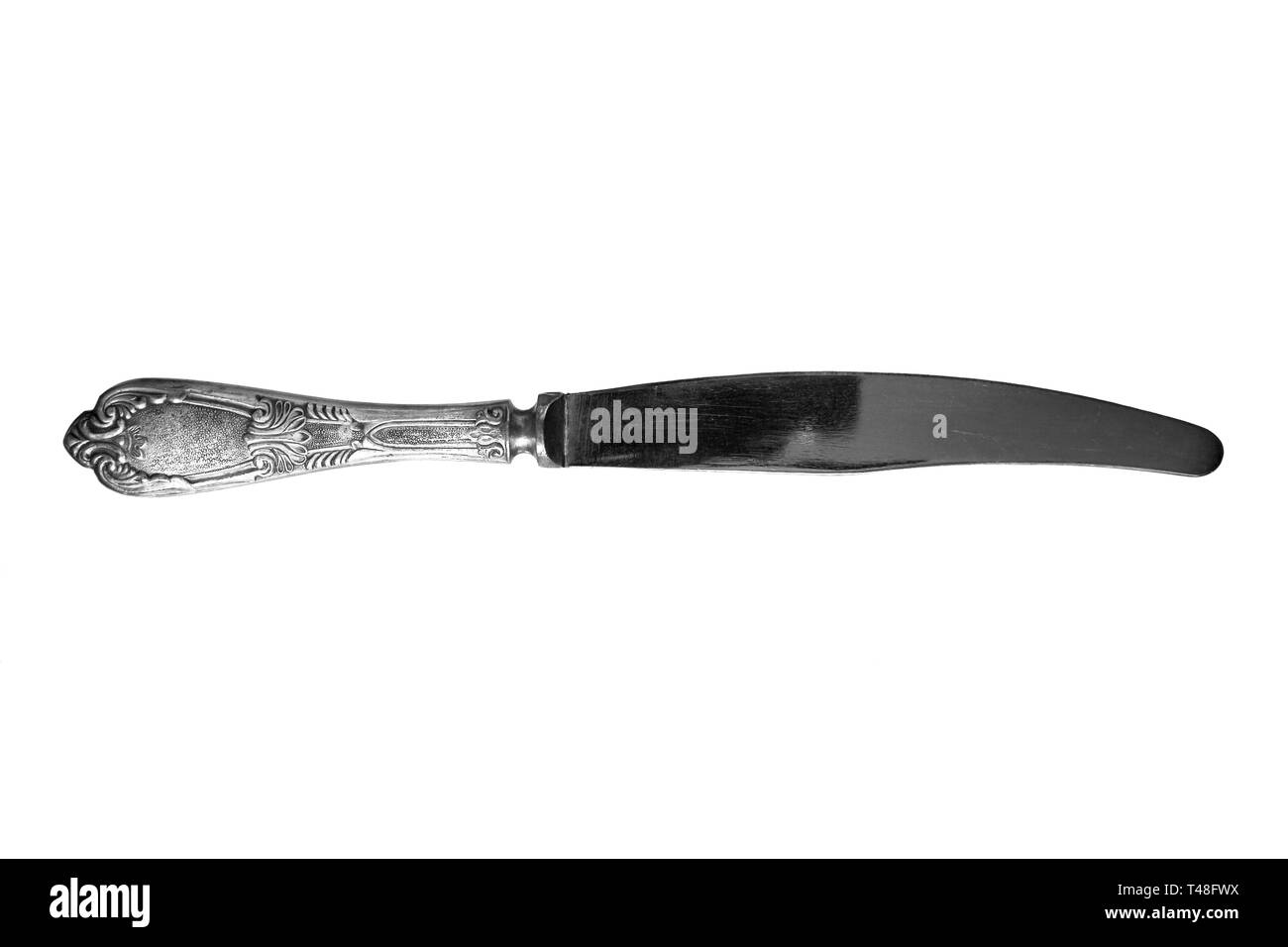 A metal silver knife on a white background. Isolate Stock Photo - Alamy