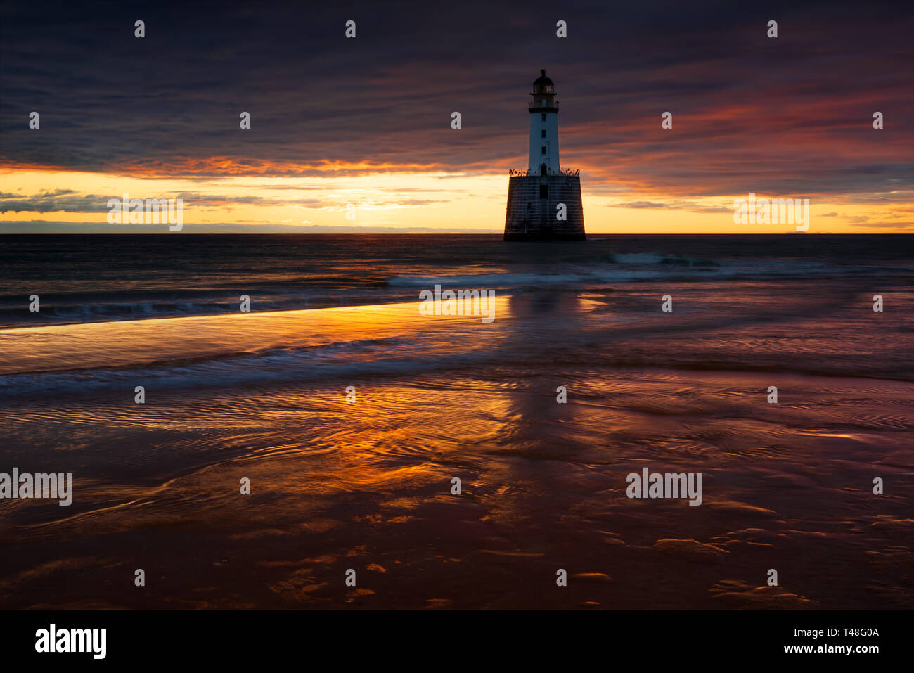 Rattray Head Lighthouse in sunrise light, east coast of Scotland Stock ...