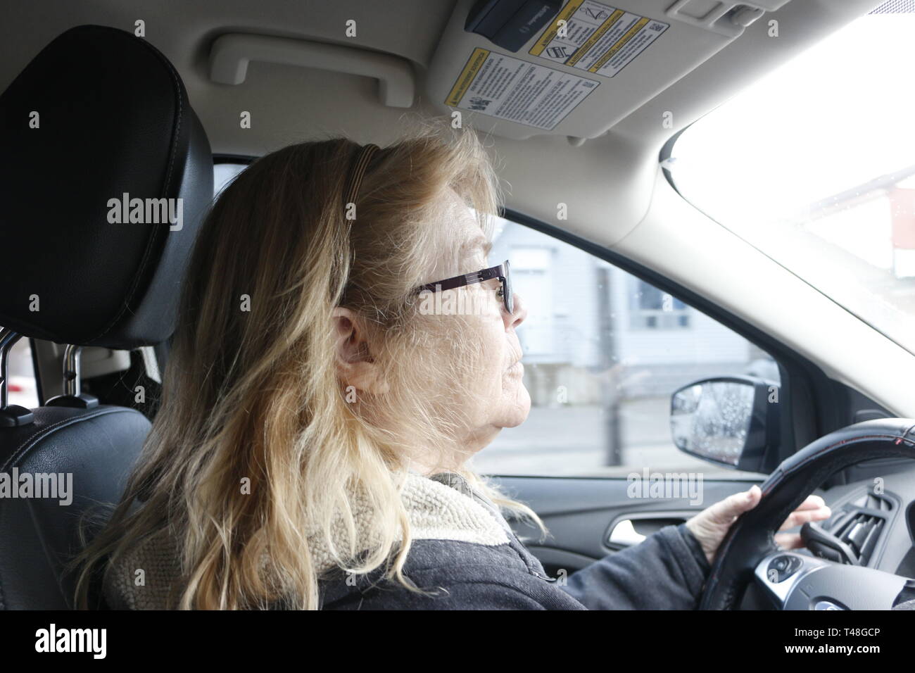 Confident senior woman driving car Stock Photo - Alamy