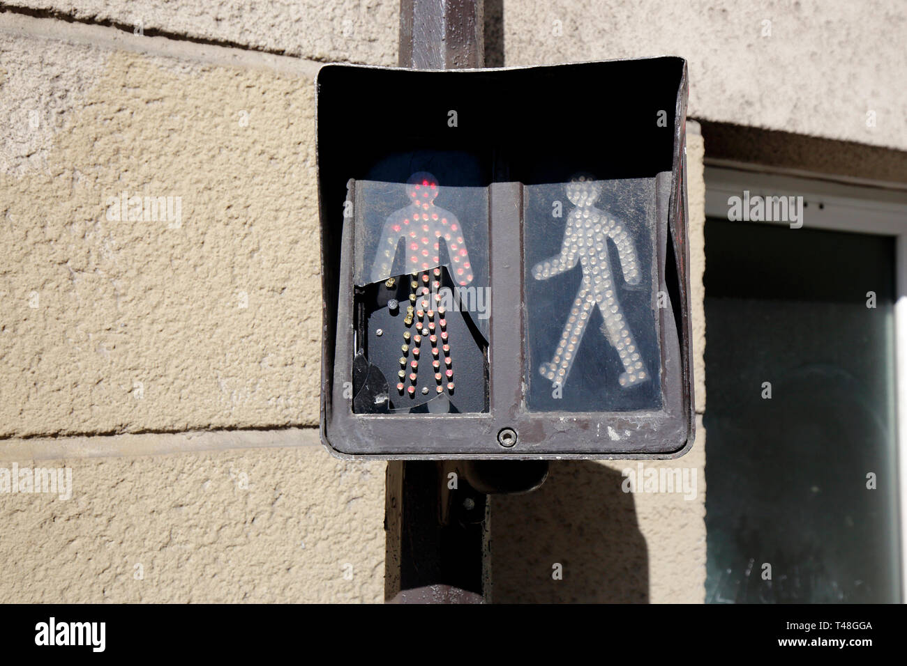 A broken pedestrian crosswalk light in Paris, France Stock Photo - Alamy