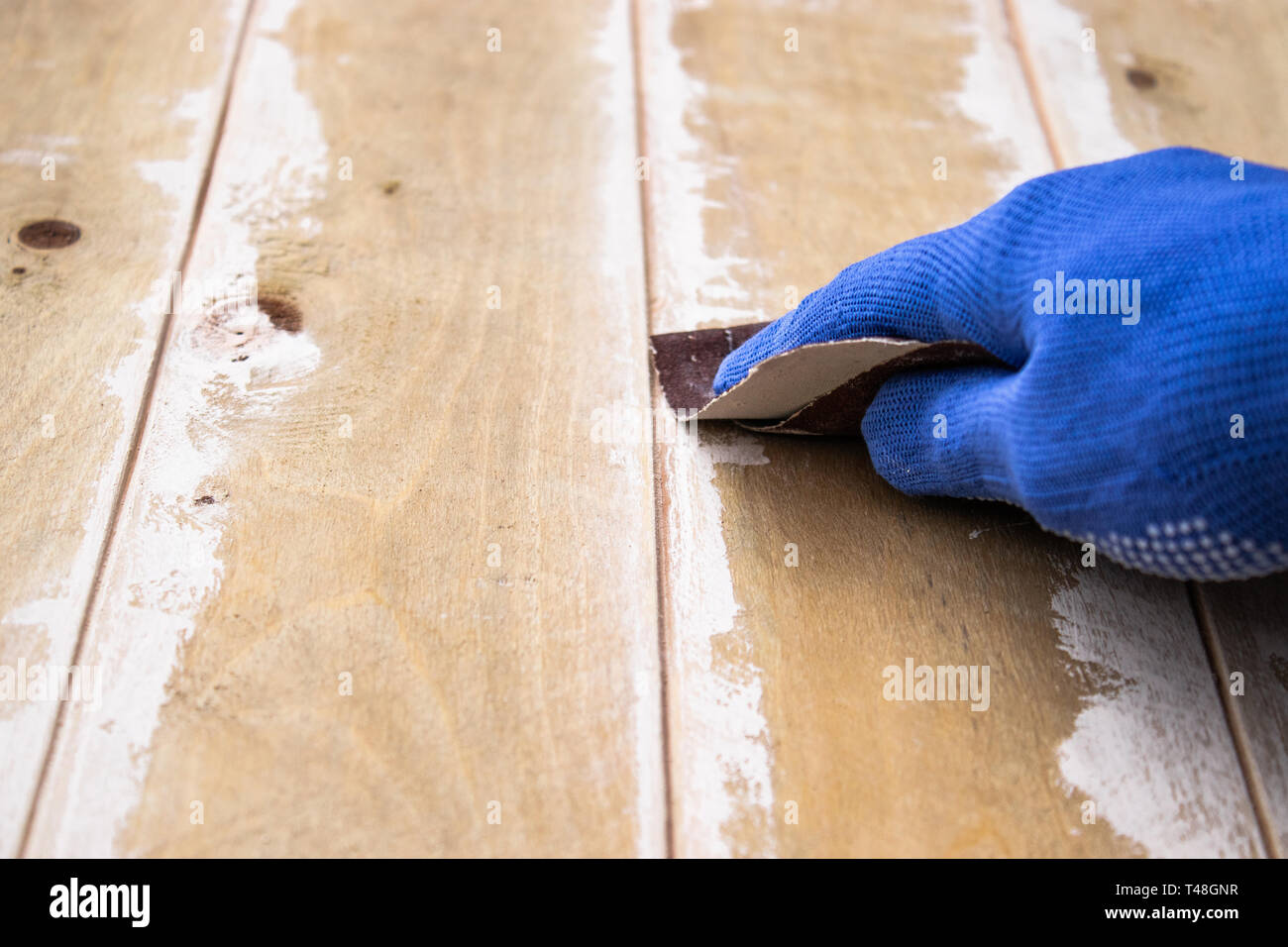 emery paper rubs the board. Grinding boards before painting ...