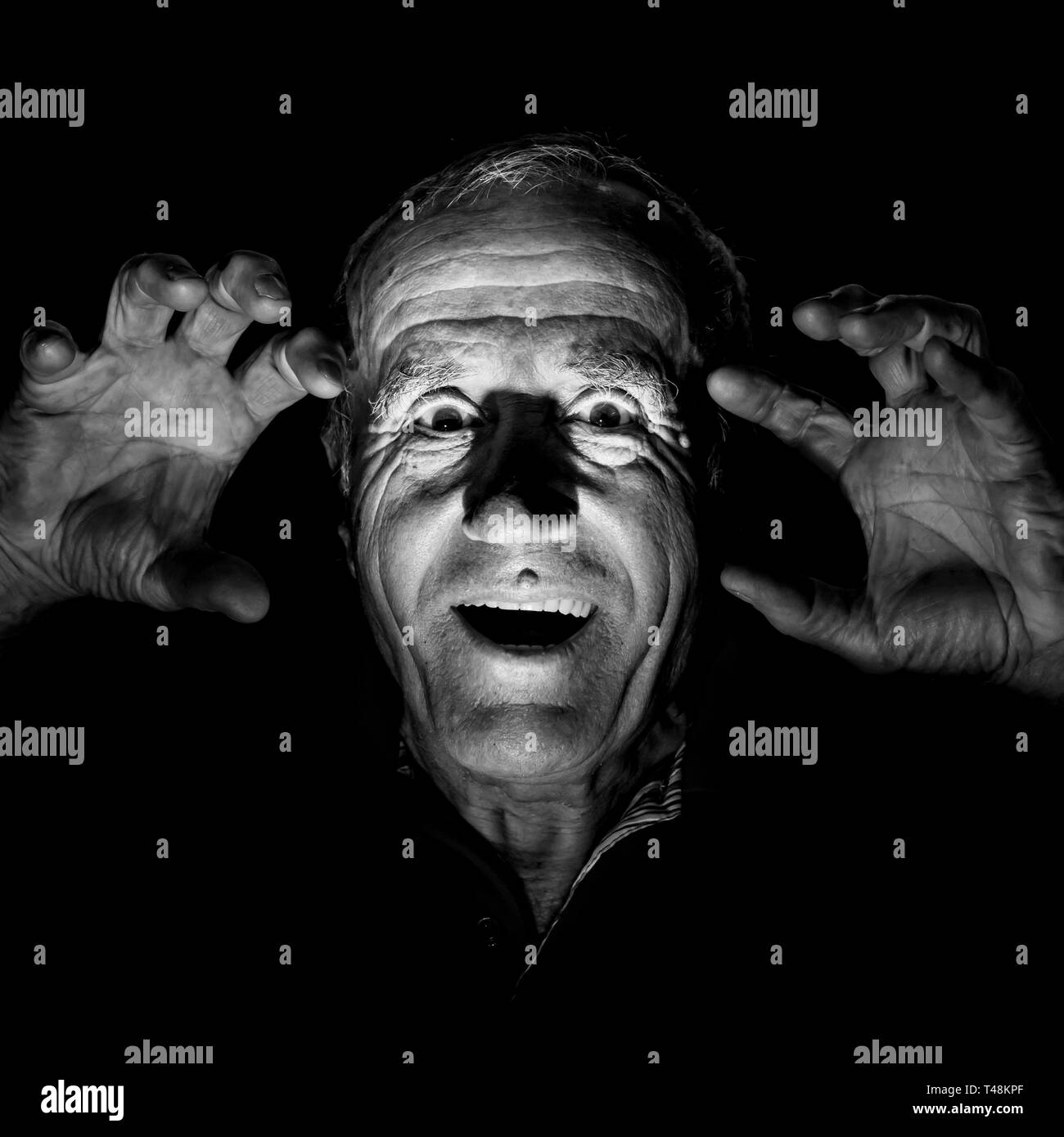 Portrait of old caucasian man who scares watcher. Fear and scare ...