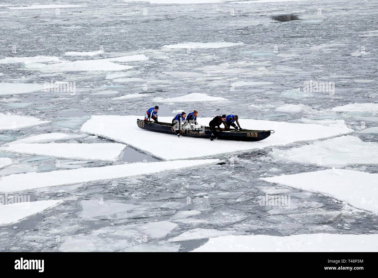 Canoe race challenge over the partly frozen Saint Lawrence River ...