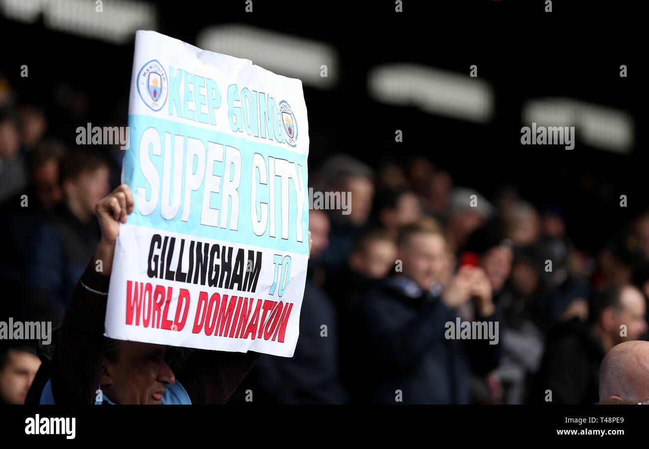 A Manchester City fan holds up a sign in the stands during the Premier ...