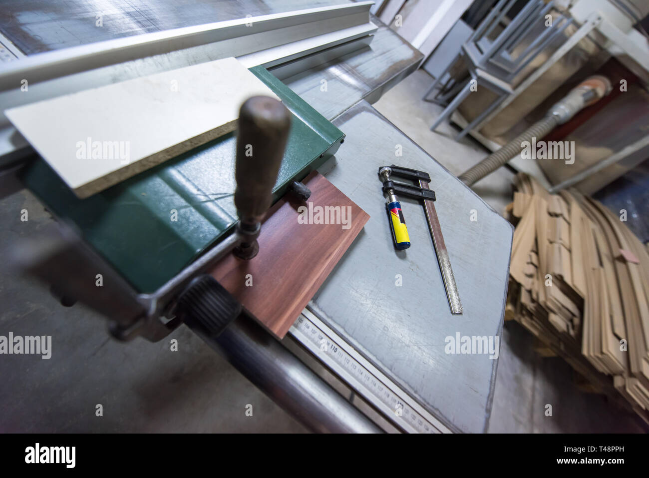 clamp and ruler tools on desk in factory for the production of wooden ...