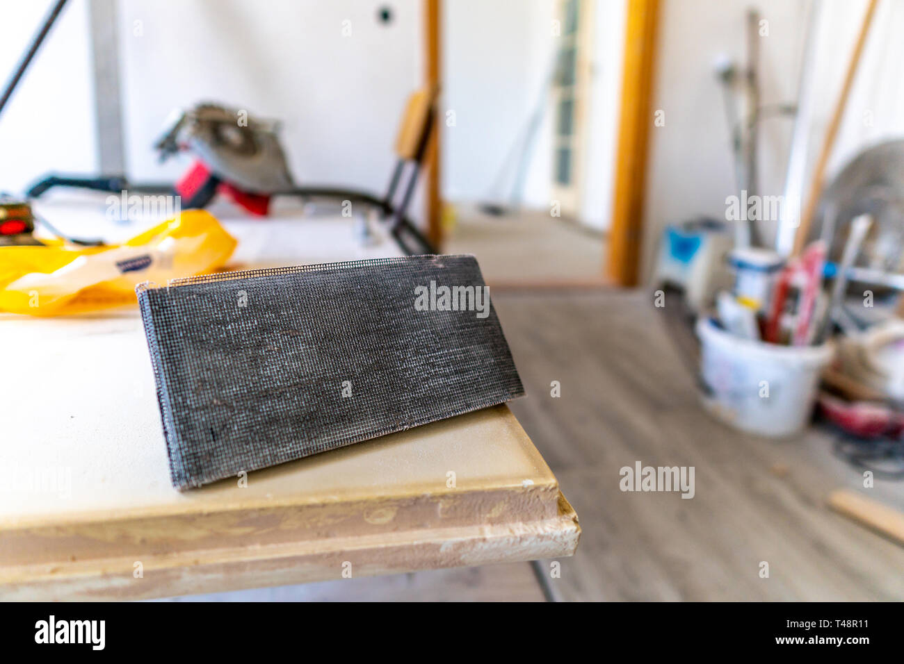 Grey Colored Rough Sand Paper with Grip Holder on a Table in a Working ...