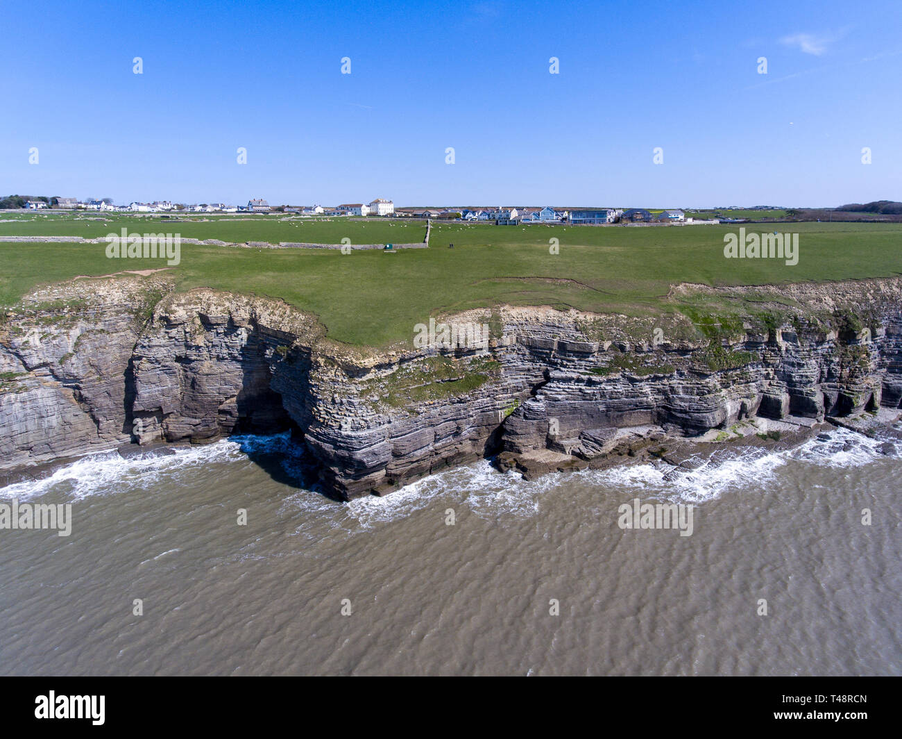 An aerial view of The beach and cliffs at Dunraven bay at Southerndown ...