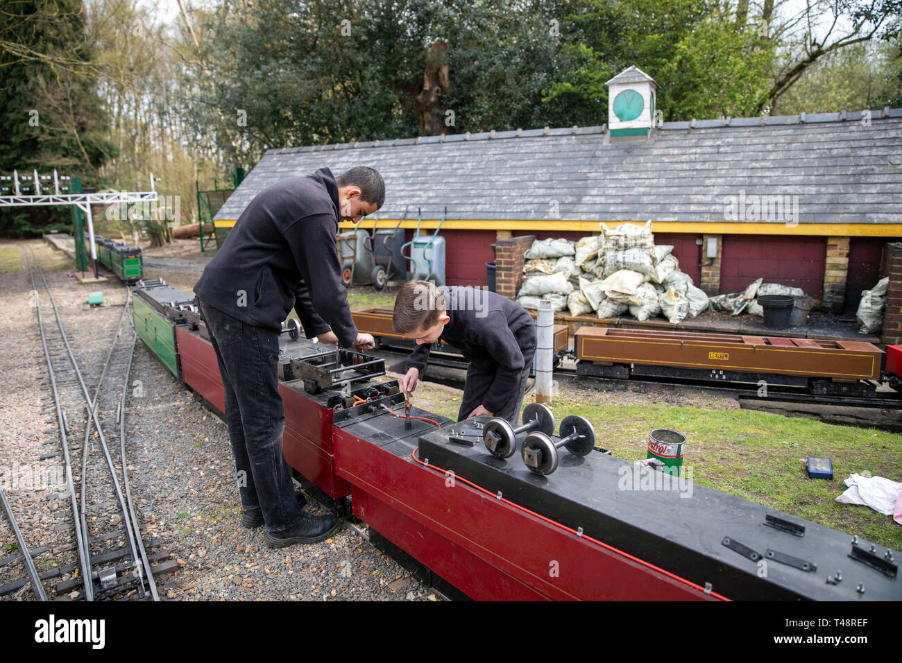 Volunteers Hashim Iqbal (left) and Liam Tickley work on the miniature ...