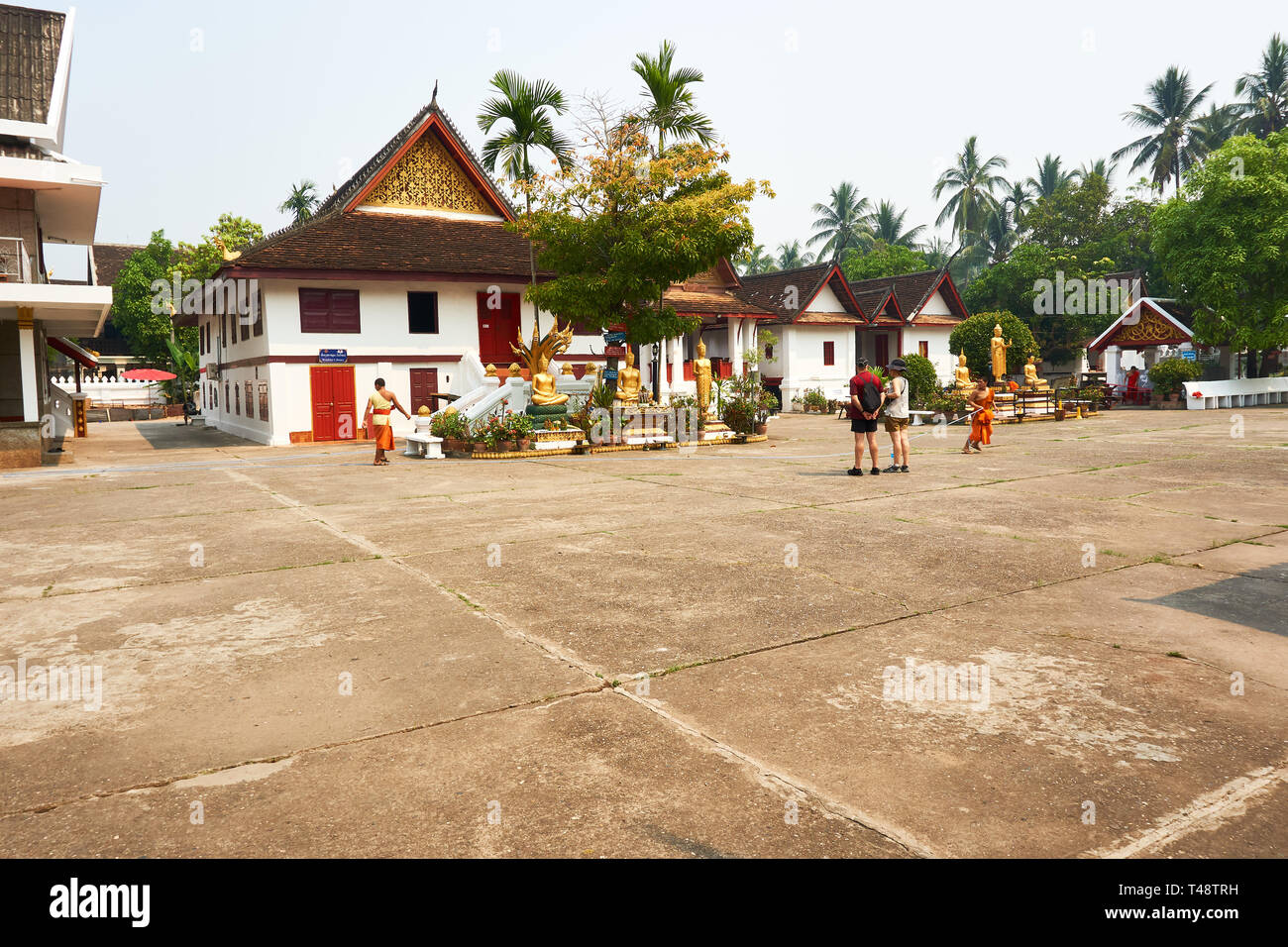 LUANG PRABANG, LAOS - APRIL 14, 2019. MONKS sit in temple at pi mai ...