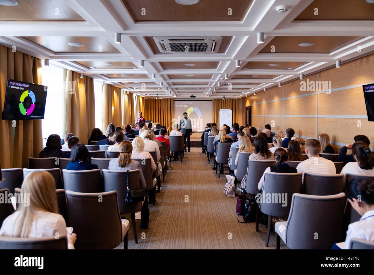 Speaker giving a talk at conference, presentation, business event ...