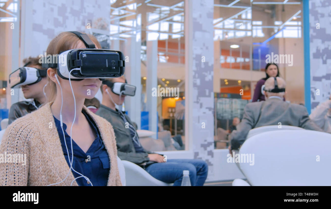 Group of people using virtual reality headset at technology show Stock ...