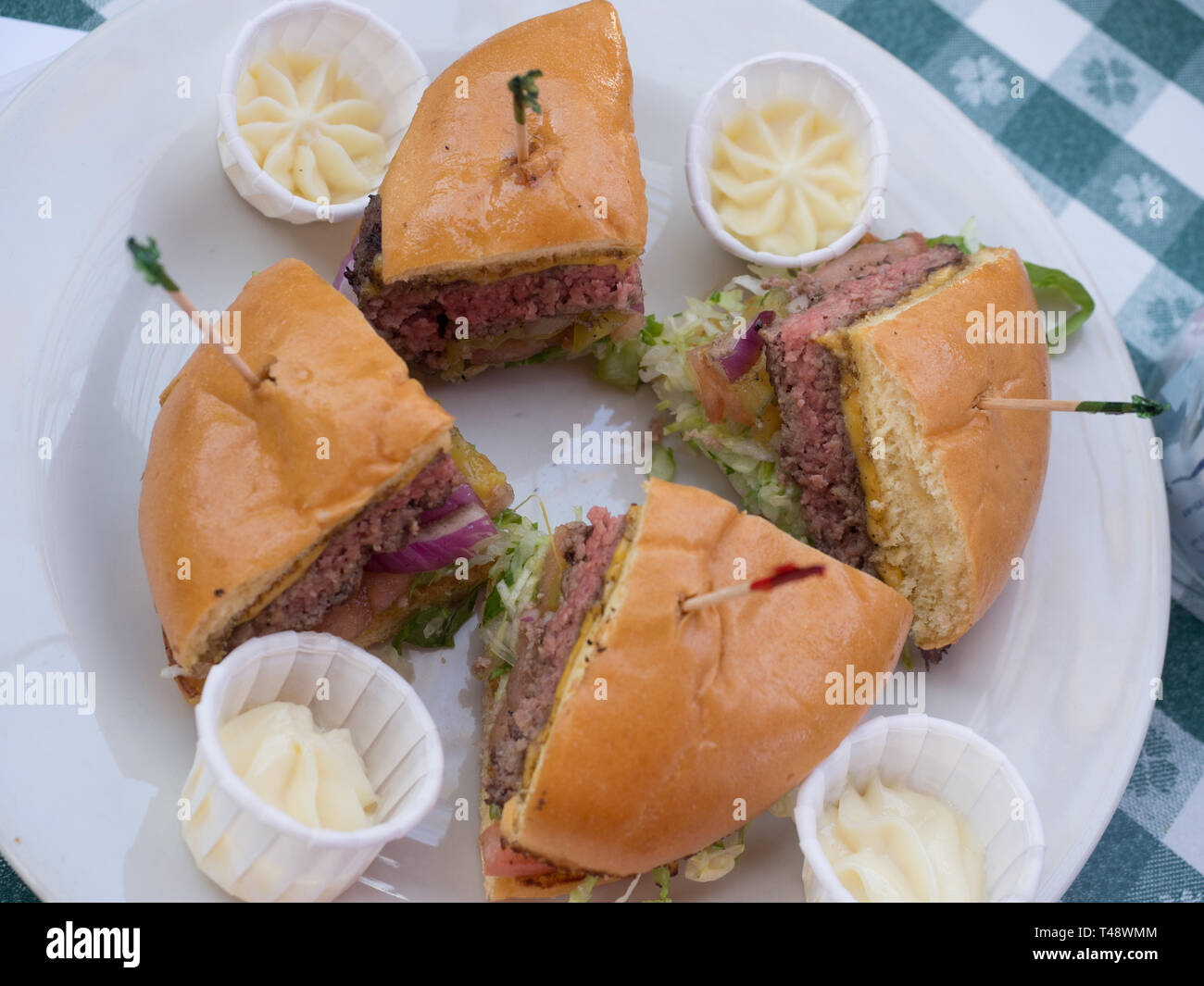 A juicy hamburger cut into 4 quarters Stock Photo - Alamy