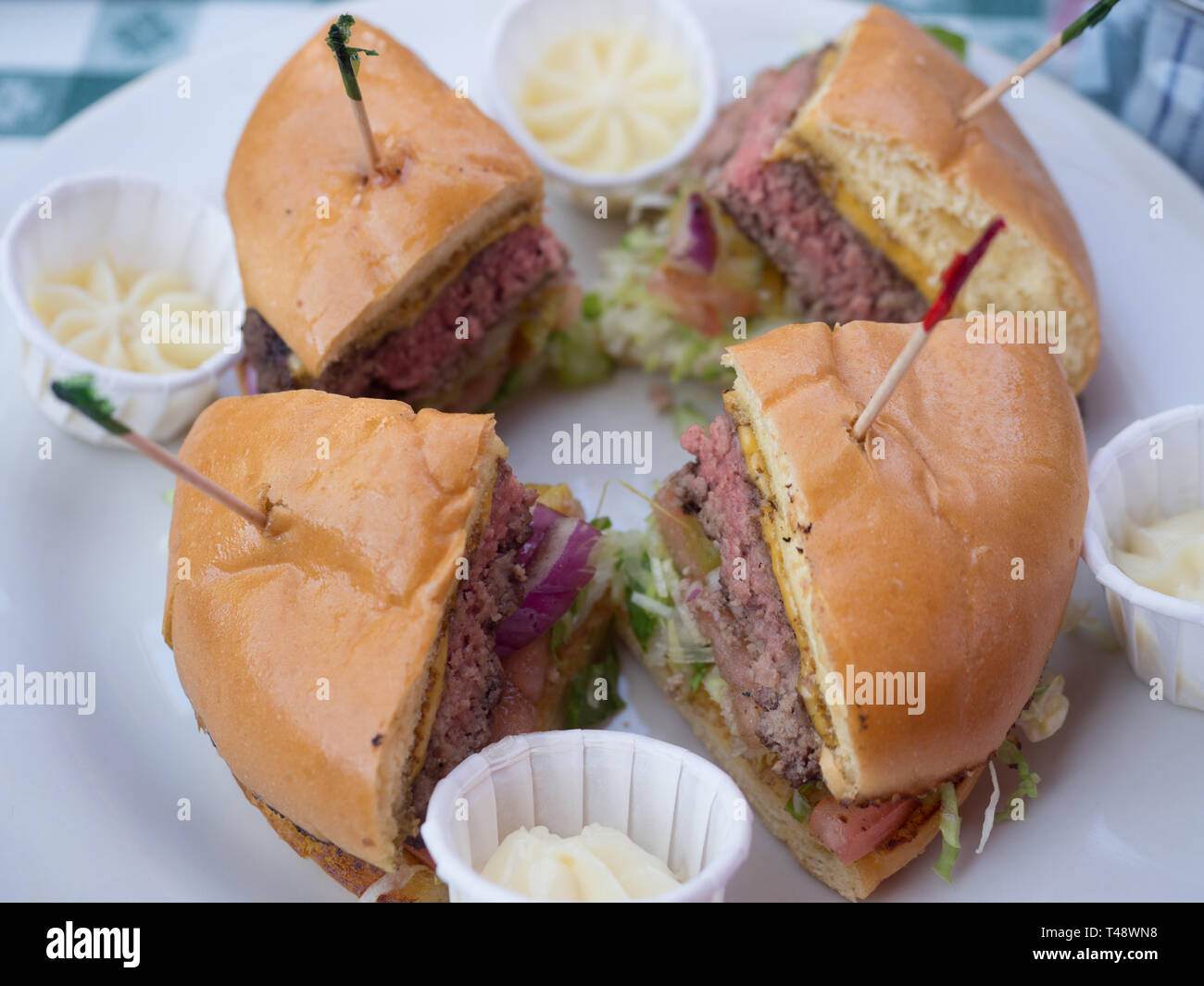 A juicy hamburger cut into 4 quarters Stock Photo - Alamy